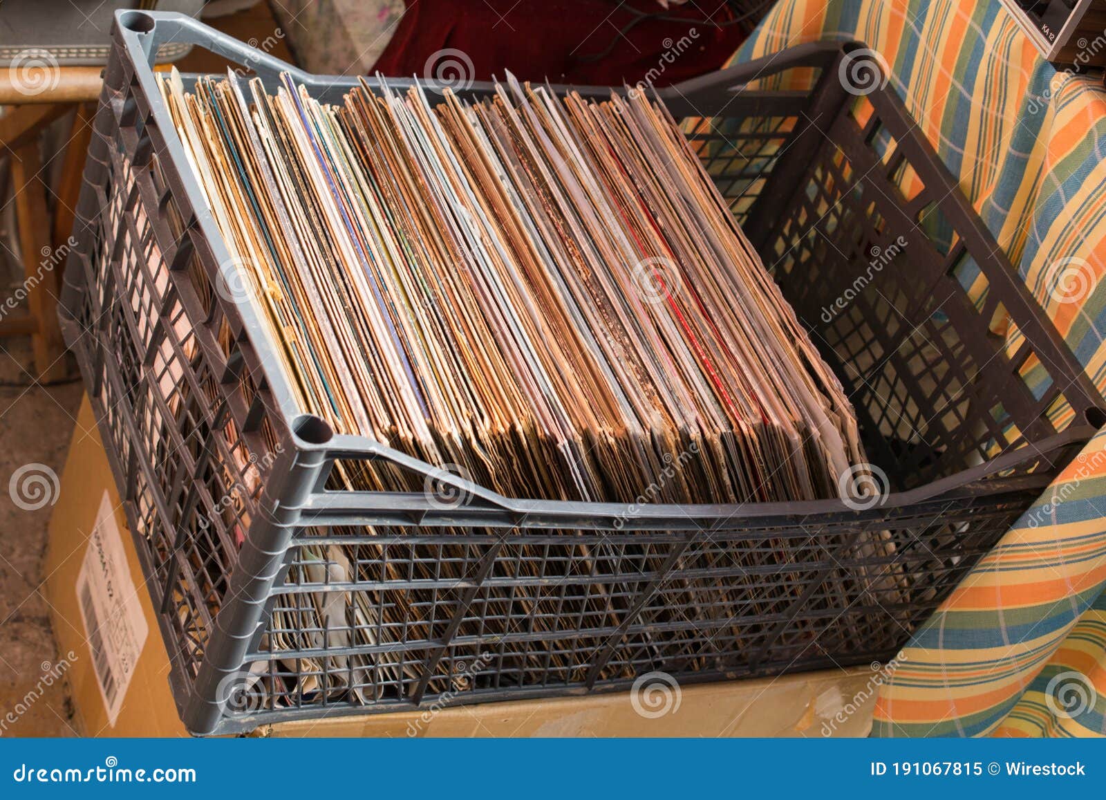 High Angle Shot of a Black Plastic Box Full of Old Vinyl CDs on Their ...
