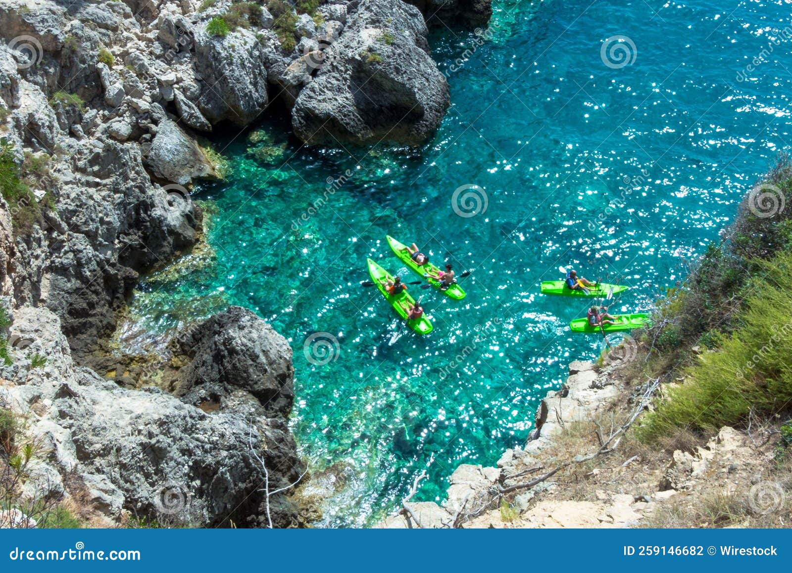 High-angle Shot of the Boys in a Canoe in a Crystalline Caribbean Sea ... High-angle Shot of the Boys in a Canoe in a Crystalline Caribbean Sea ...