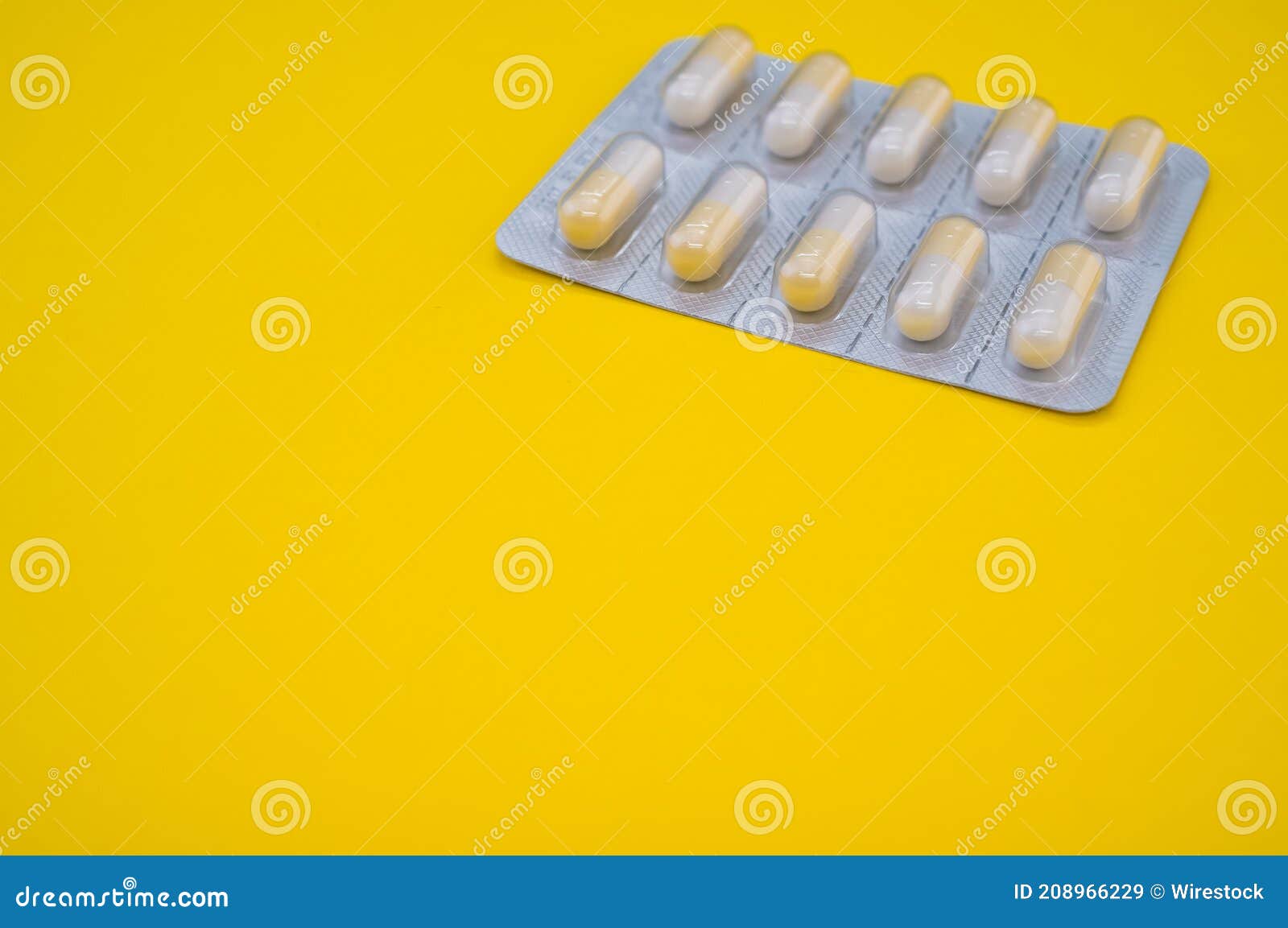High Angle Shot of a Capsule Tablet Pack Isolated on a Yellow ...