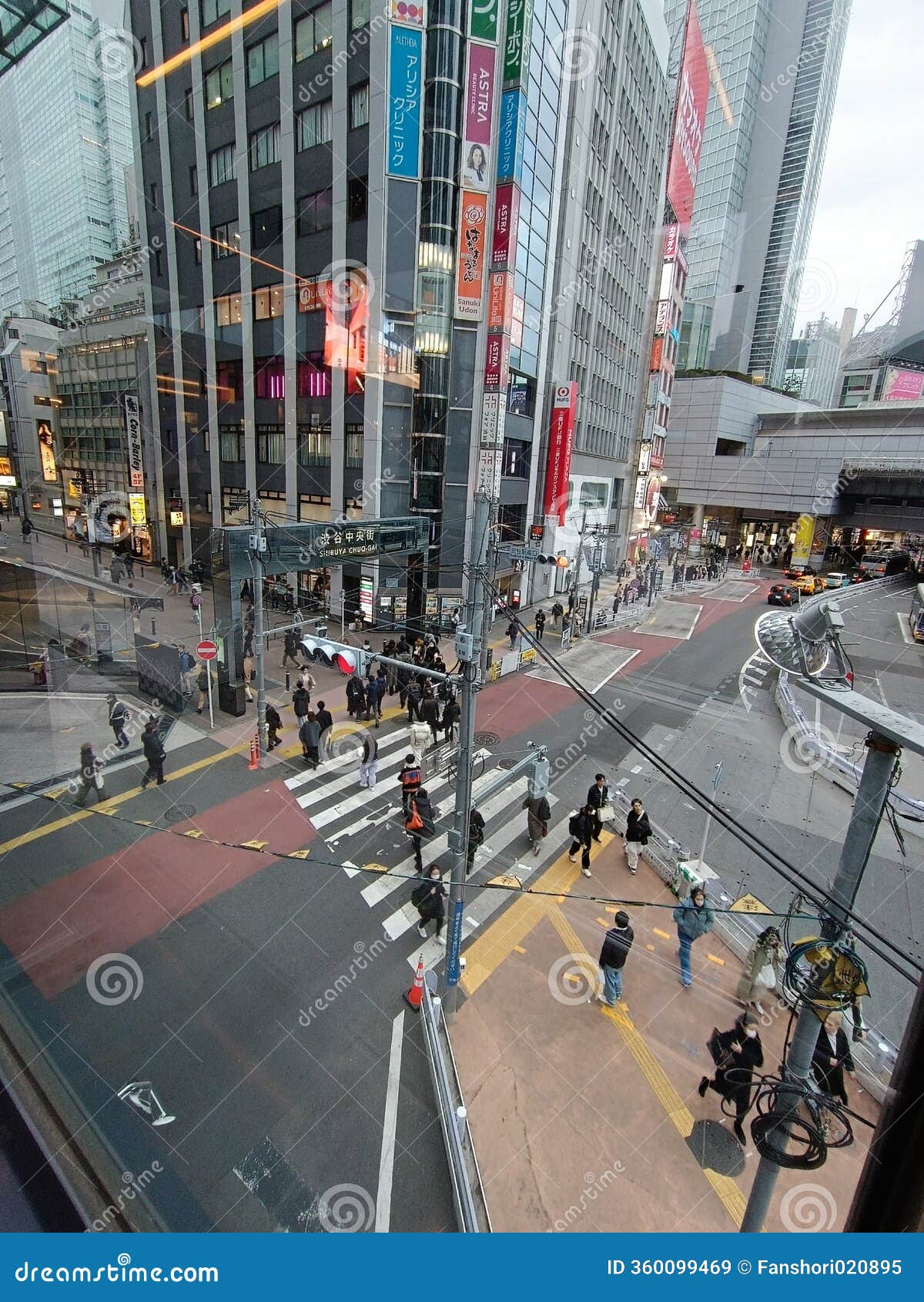 A High-angle Shot Capturing the Movement of People and Vehicles at a ...
