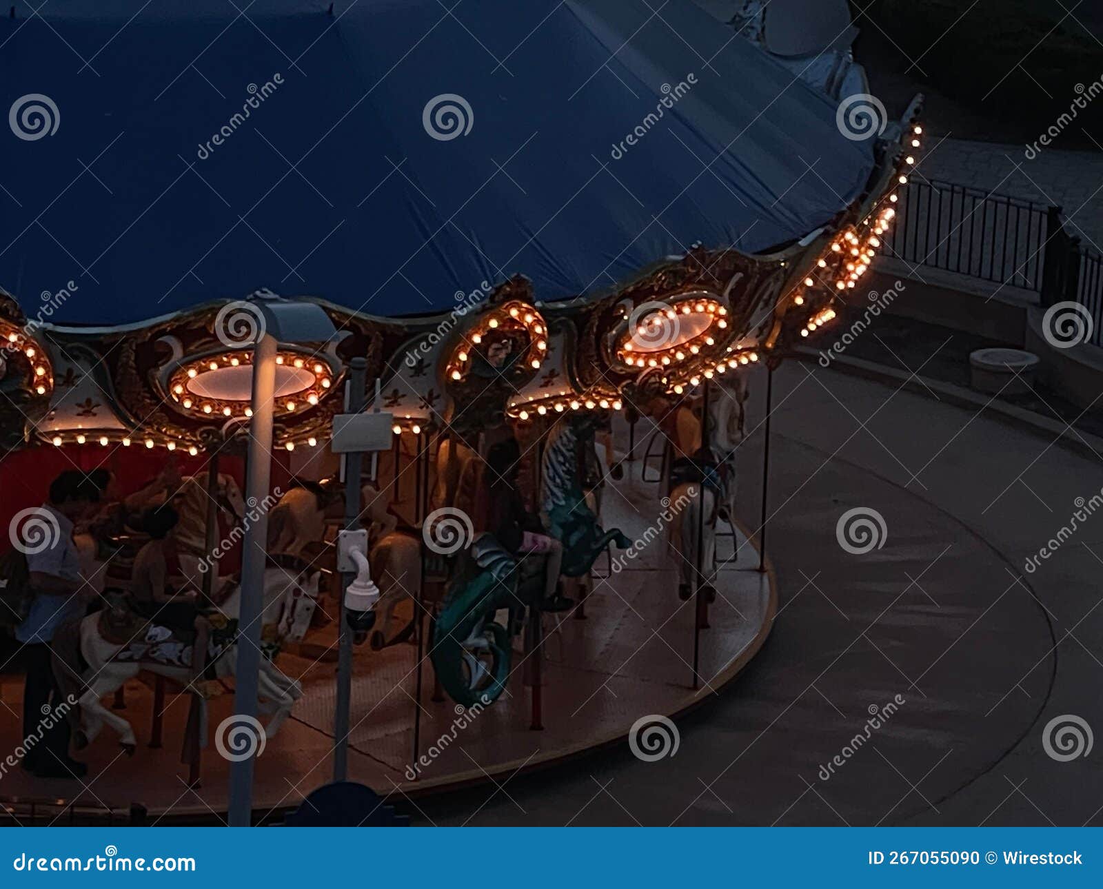 High Angle Shot of a Carousel in an Amusement Park, Illuminated in ...