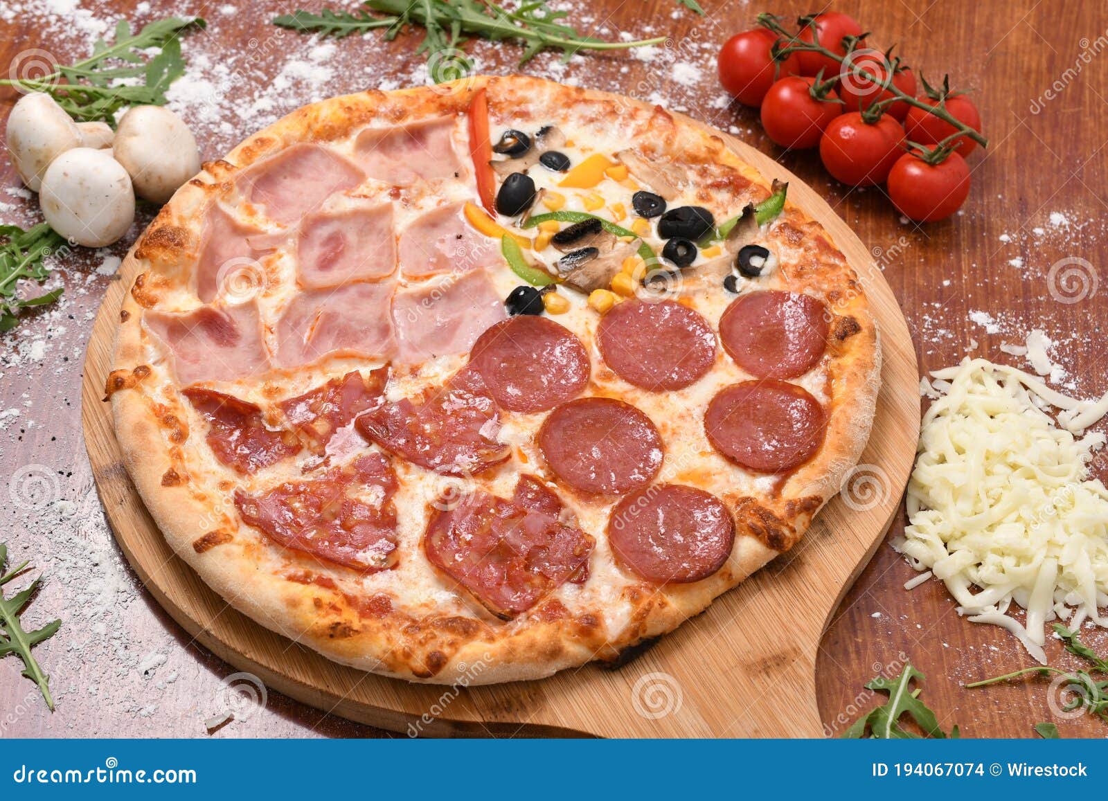 High Angle Shot of a Delicious Pizza Divided into Four Sections with ...