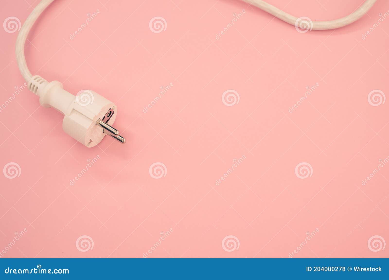 High Angle Shot of an Electrical Wire and Plug on a Pink Surface Stock ...