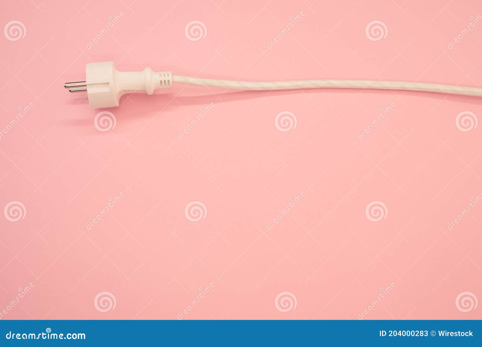 High Angle Shot of an Electrical Wire and Plug on a Pink Surface Stock ...