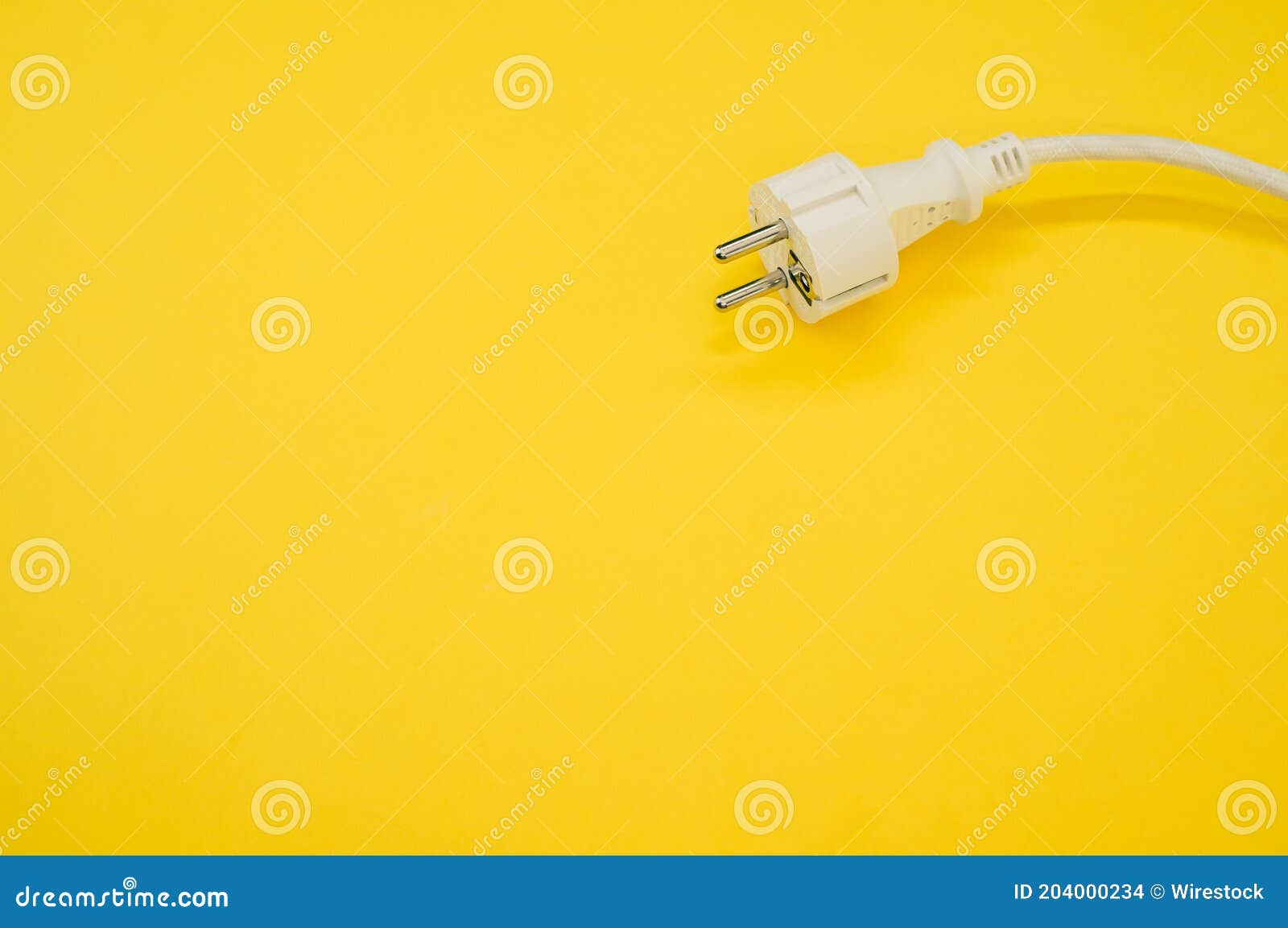 High Angle Shot of an Electrical Wire and Plug on a Yellow Surface ...