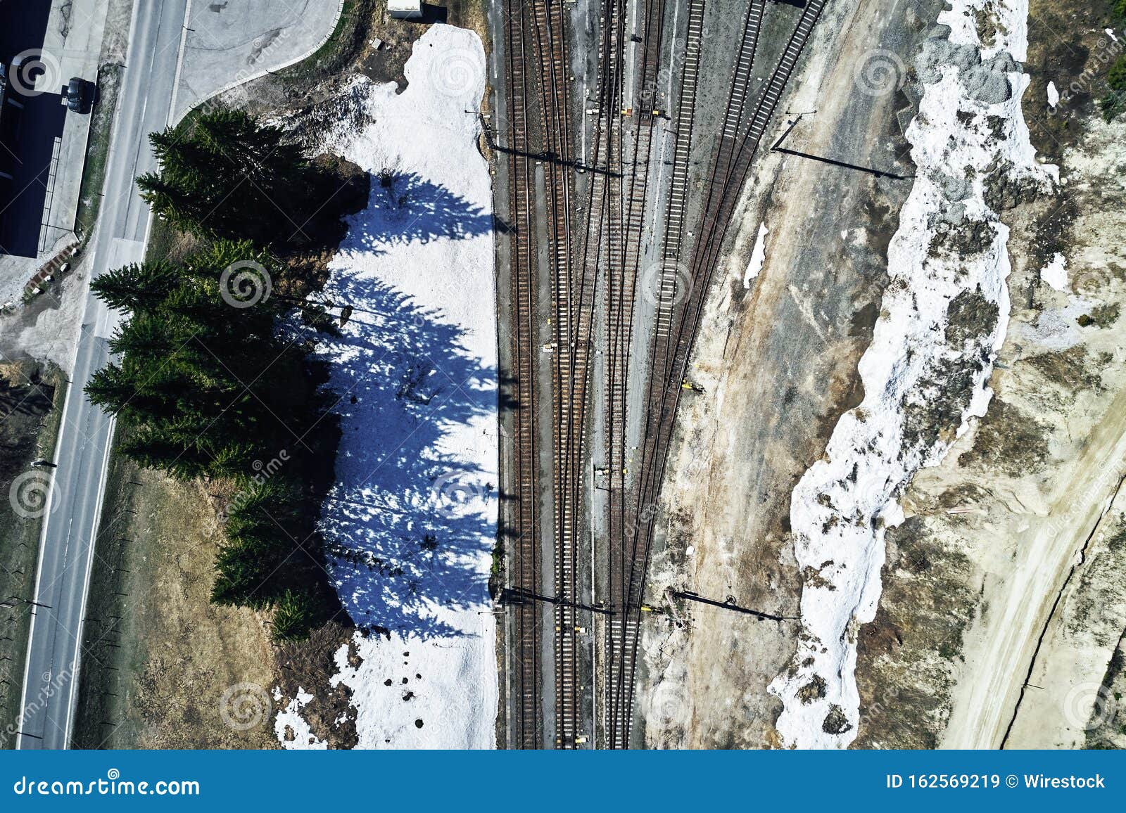 High Angle Shot of an Empty Railway with Multiple Rails Surrounded by ...
