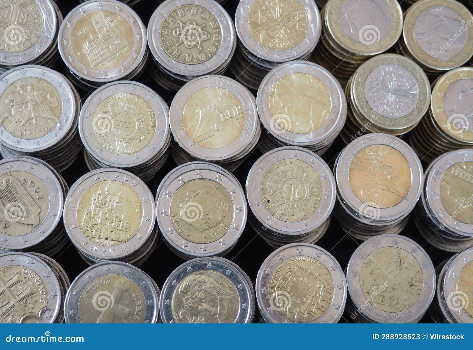 High-angle Shot of 2 Euro Coin Stacks Under the Bright Light Stock ...
