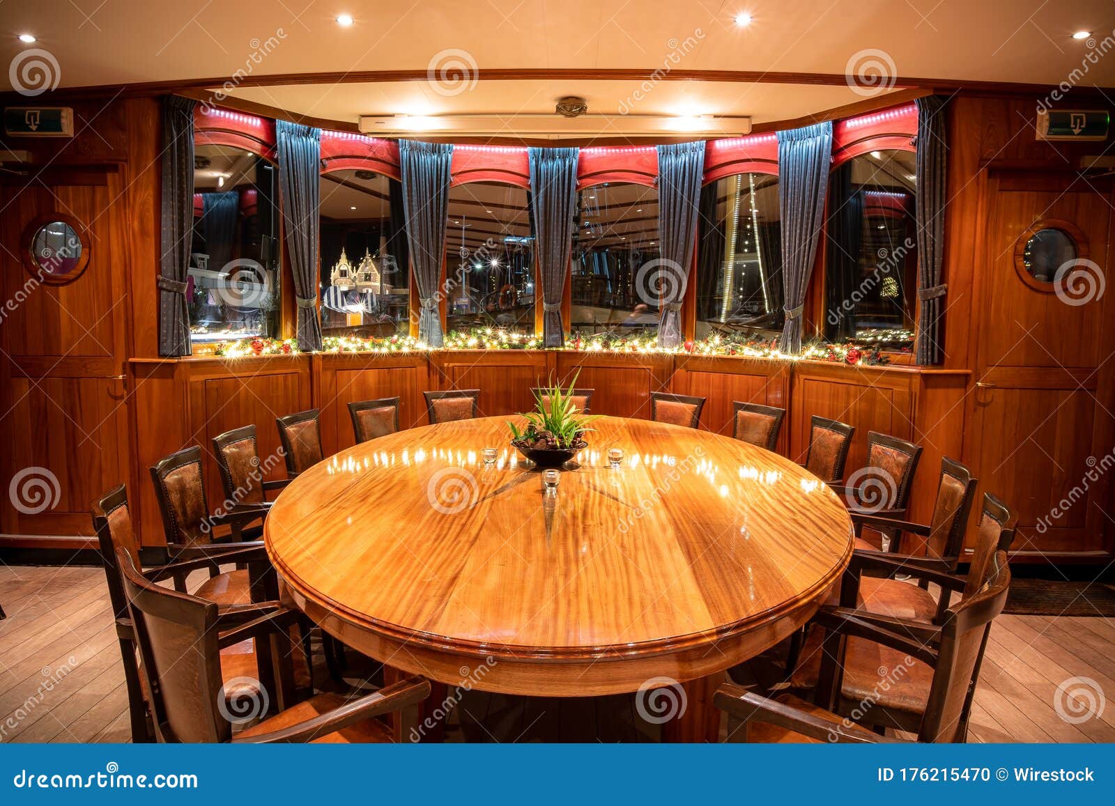 High Angle Shot of a Fancy Restaurant Round Table with Windows on the ...
