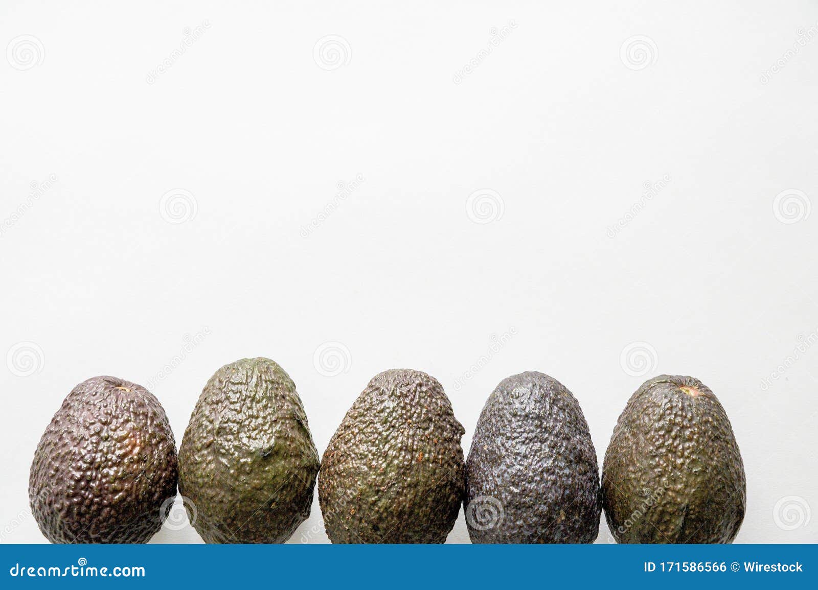High Angle Shot of Five Avocados on a White Surface Stock Photo - Image ...