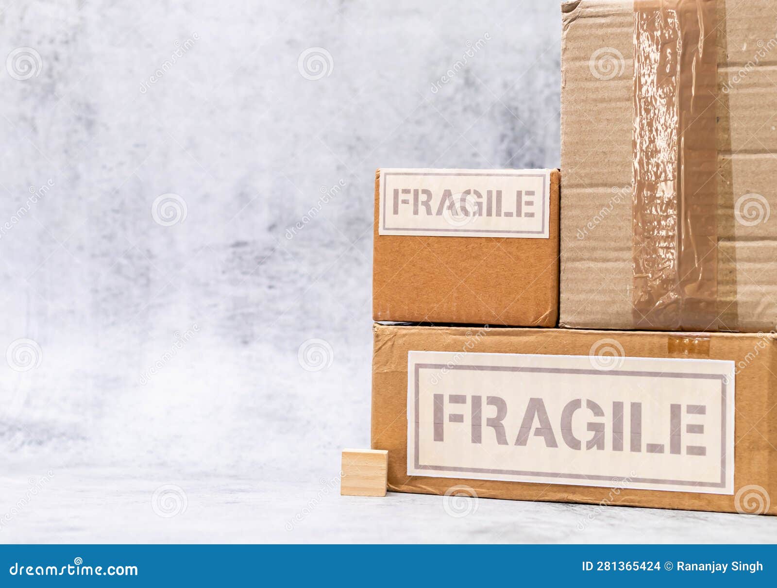 High Angle Shot of Fragile Boxes Along with Wooden Cube Placed on ...