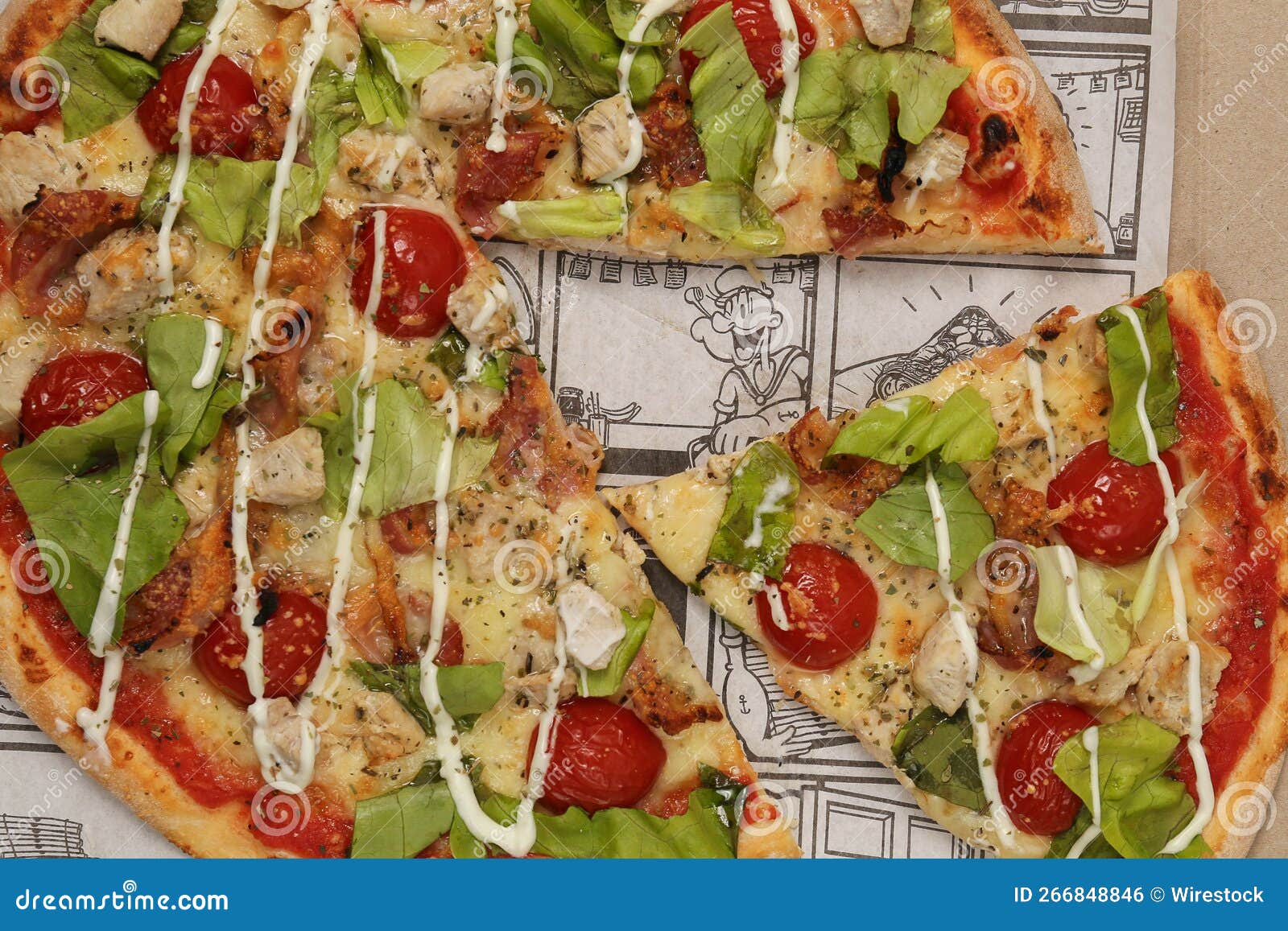 High Angle Shot of a Gourmet Pizza with Various Toppings on a Messy ...
