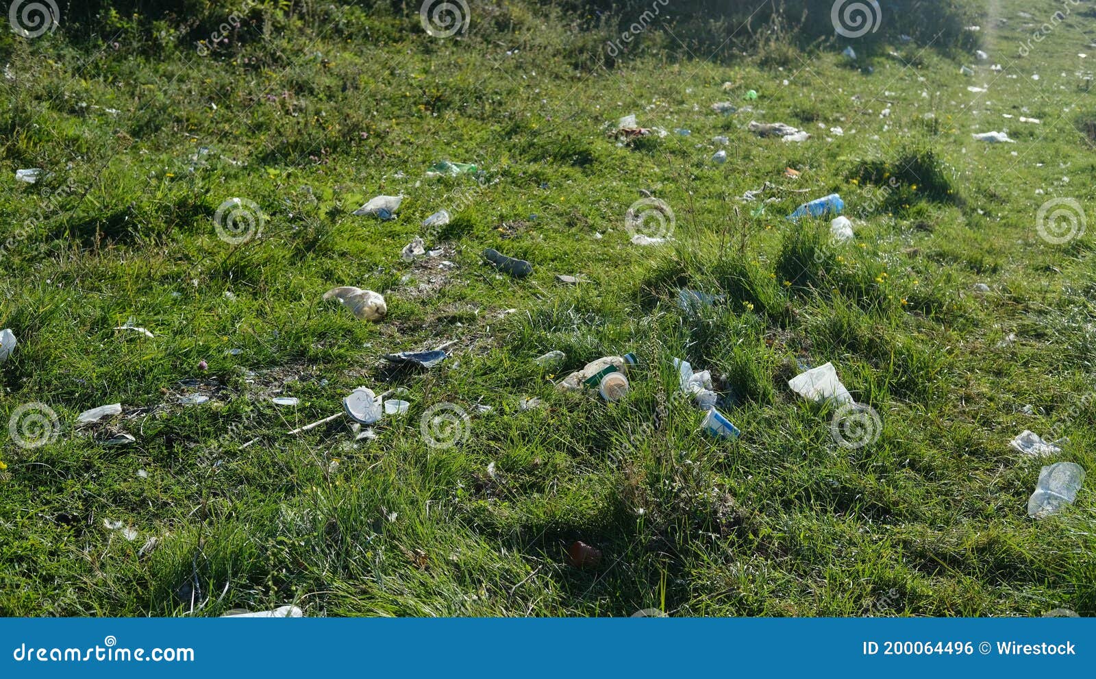 High Angle Shot of a Grass Field Polluted with Rubbish Stock Photo ...