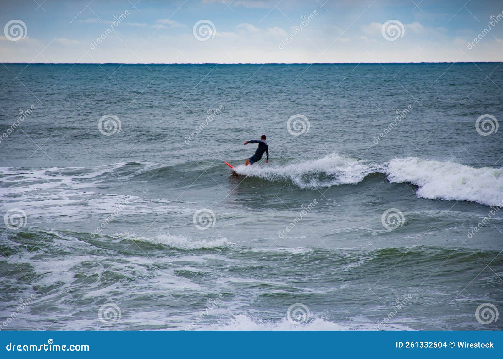 High Angle Shot of a Guy Surfing on an Ocean Wave Stock Photo - Image ...