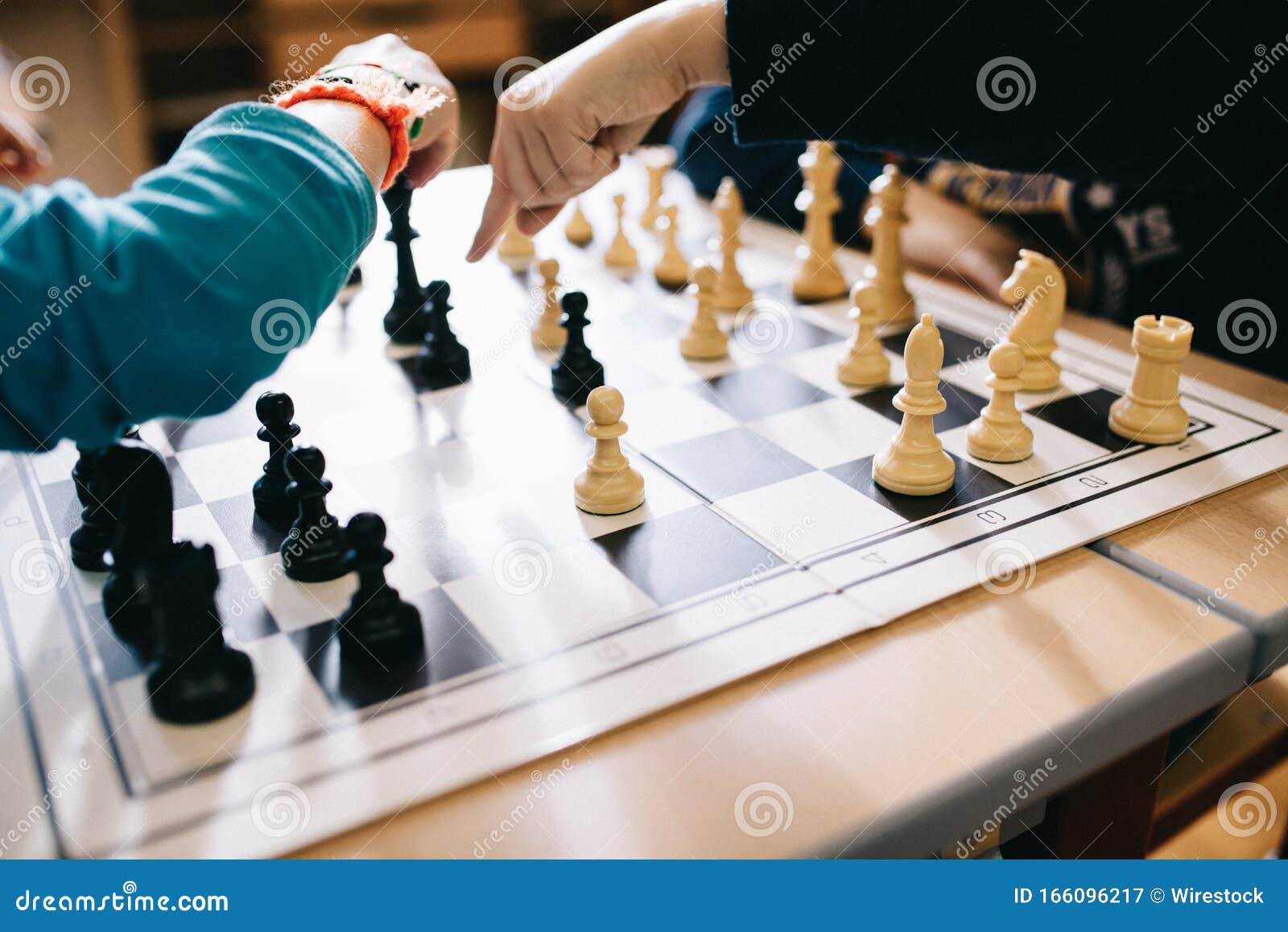 High Angle Shot of Human Hands Playing Chess and Replacing the Figures ...
