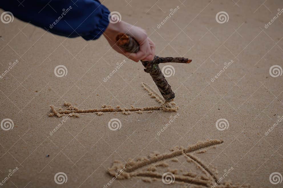 High Angle Shot of a Human& X27;s Hand Writing Something with the Help ...