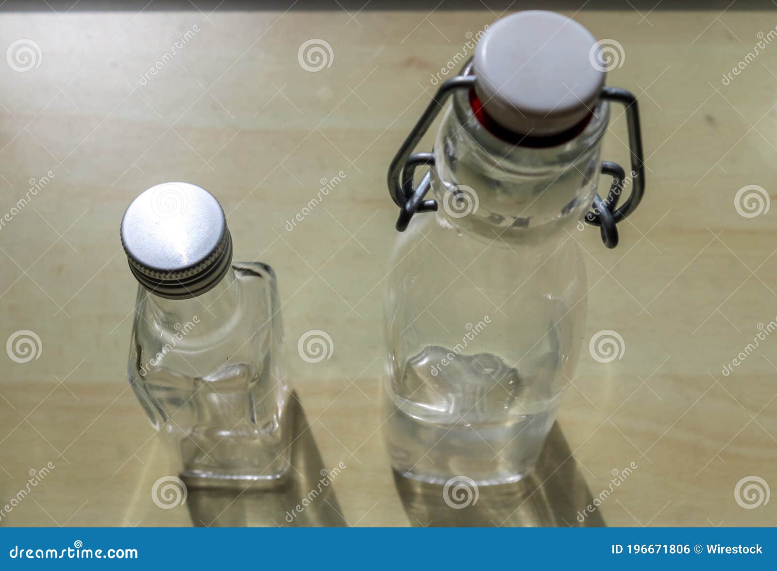 High Angle Shot of Lass Bottles with Caps Stock Photo - Image of ...