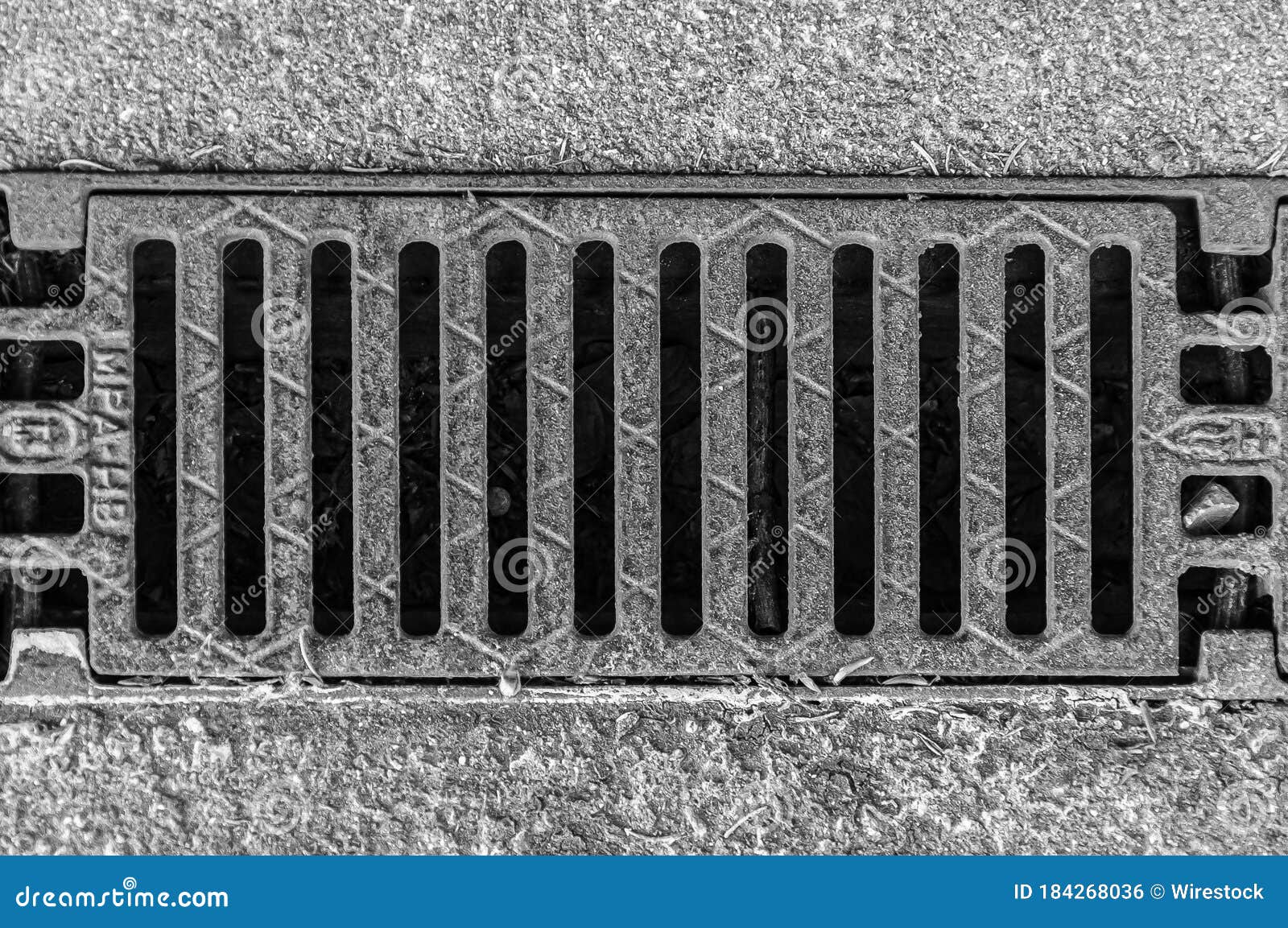 High Angle Shot of the Metal Sewer Gate on the Asphalt Ground Stock ...