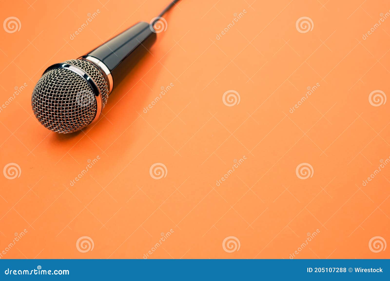 High Angle Shot of a Microphone on an Orange Surface Stock Photo ...