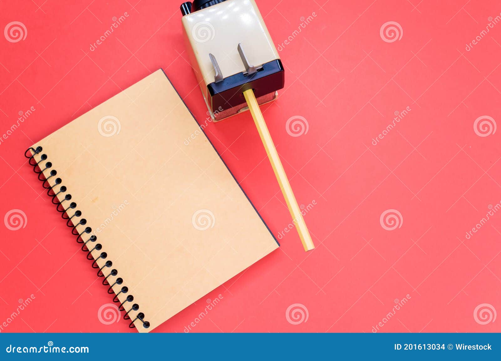 High Angle Shot of a Notebook and a Mechanical Pencil Sharpener on a ...