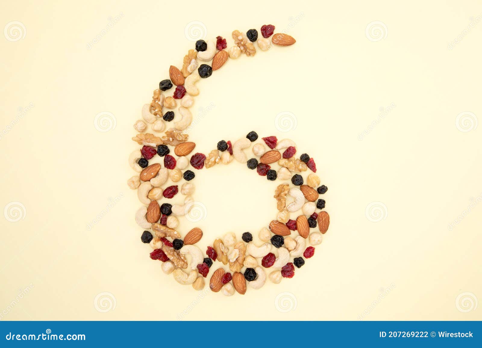 High Angle Shot of Nuts and Seeds Shaped Like Number 6 on a Yellow ...