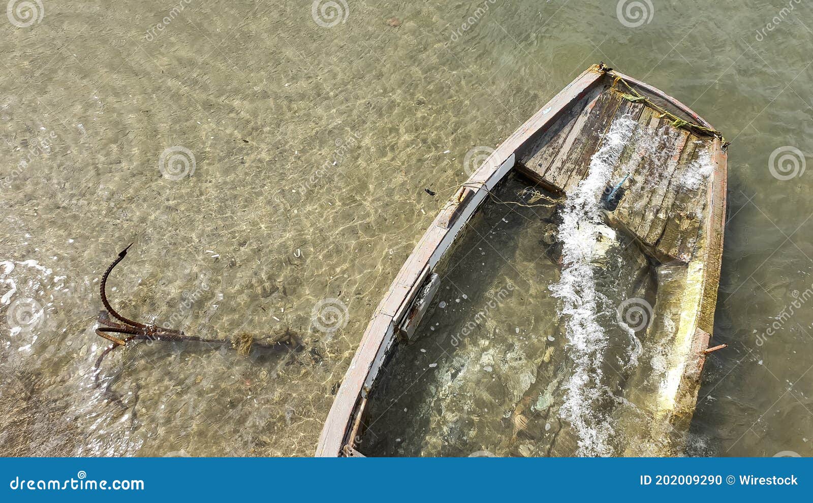 High Angle Shot of an Old and Cracked Boat in the Water Stock Photo ...