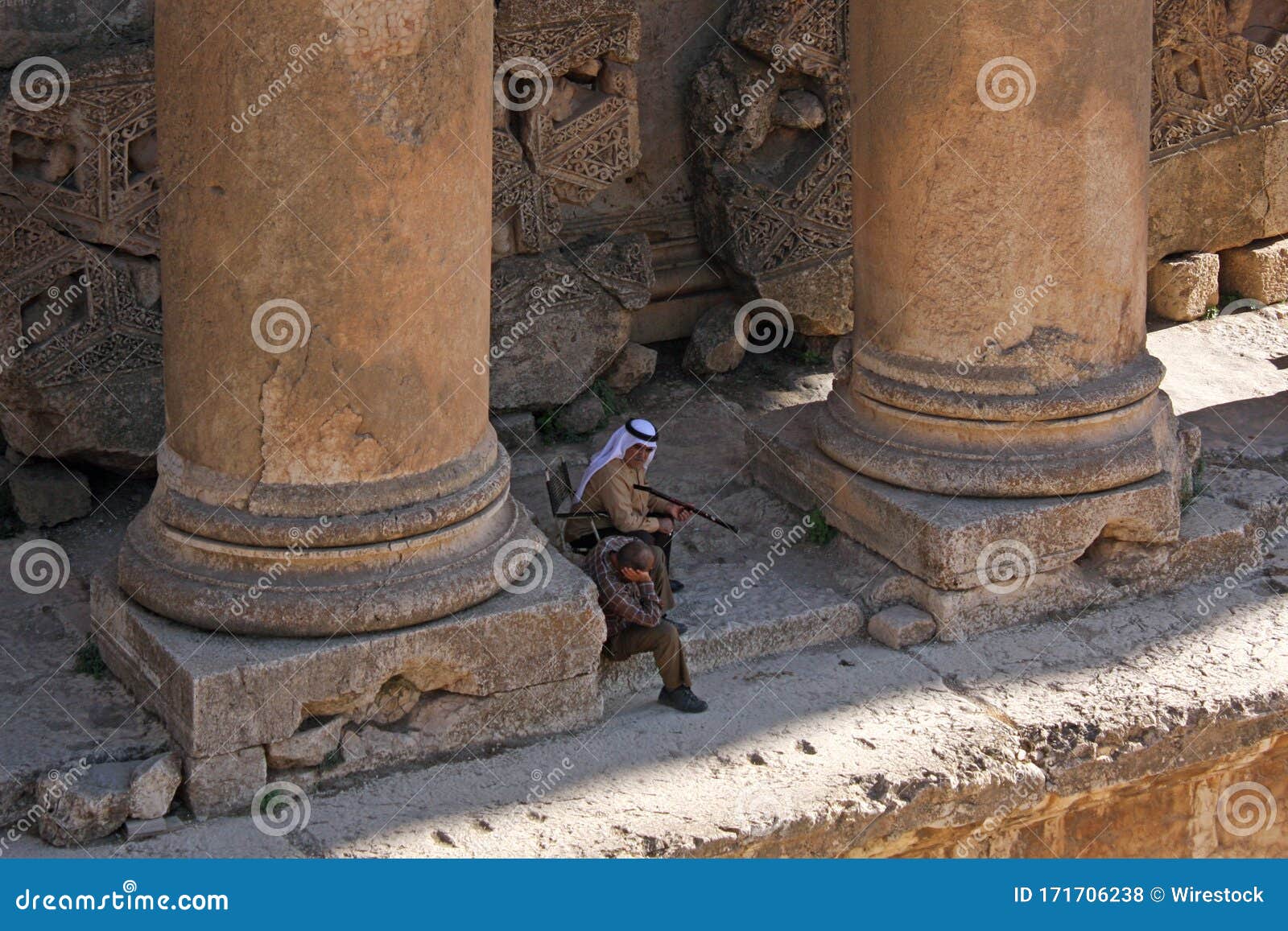 High Angle Shot of a Person Sitting between Two Columns Editorial Stock ...