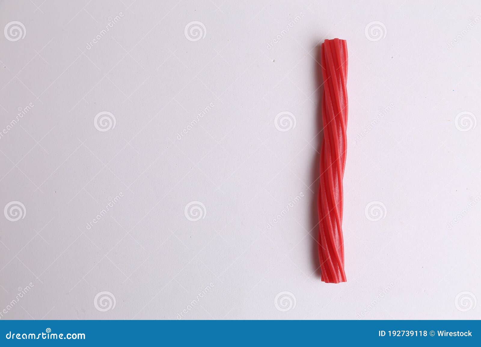 High Angle Shot of a Red Stick Candy Isolated on a White Surface Stock ...