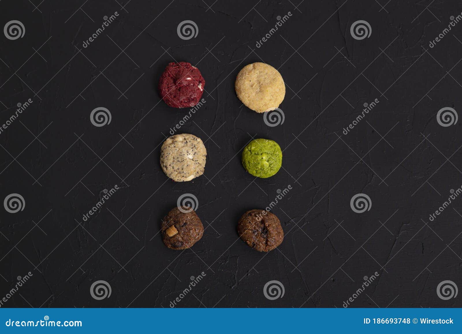 High Angle Shot of Six Different Cookies on a Black Rough Surface Stock ...