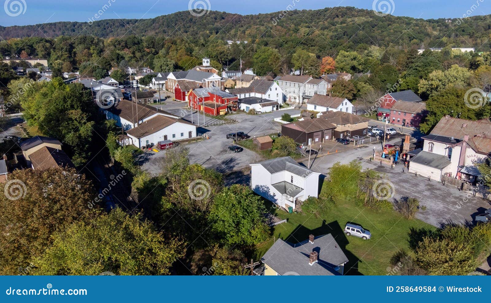 High Angle Shot of a Small Town Surrounded by Trees Stock Photo - Image ...