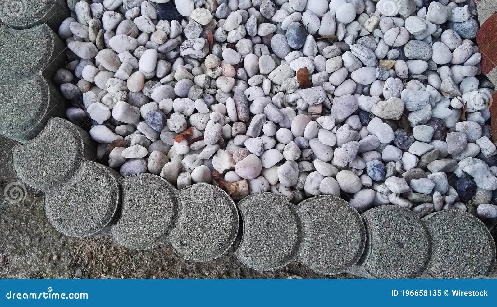 High Angle Shot of Small White Rocks Bunch Surrounded by Grey Tiles ...