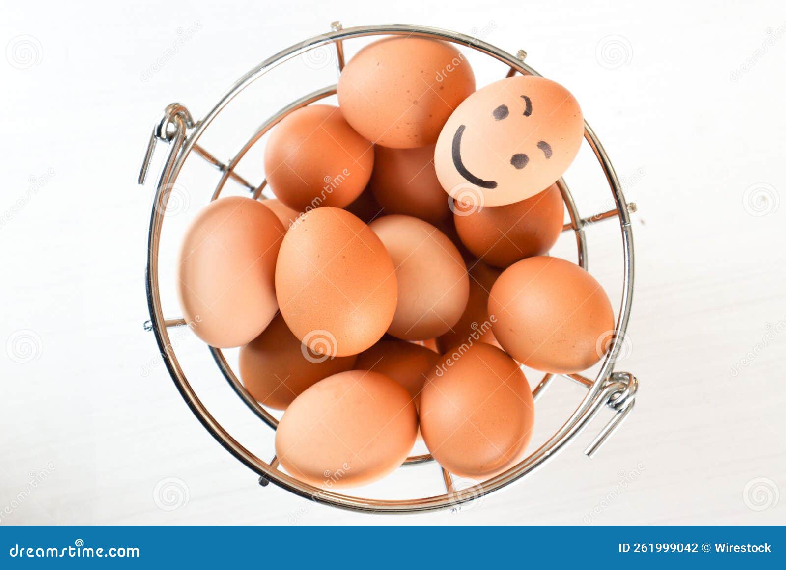 High-angle Shot of a Smiley Egg on Top of Other Eggs in the Steel ...