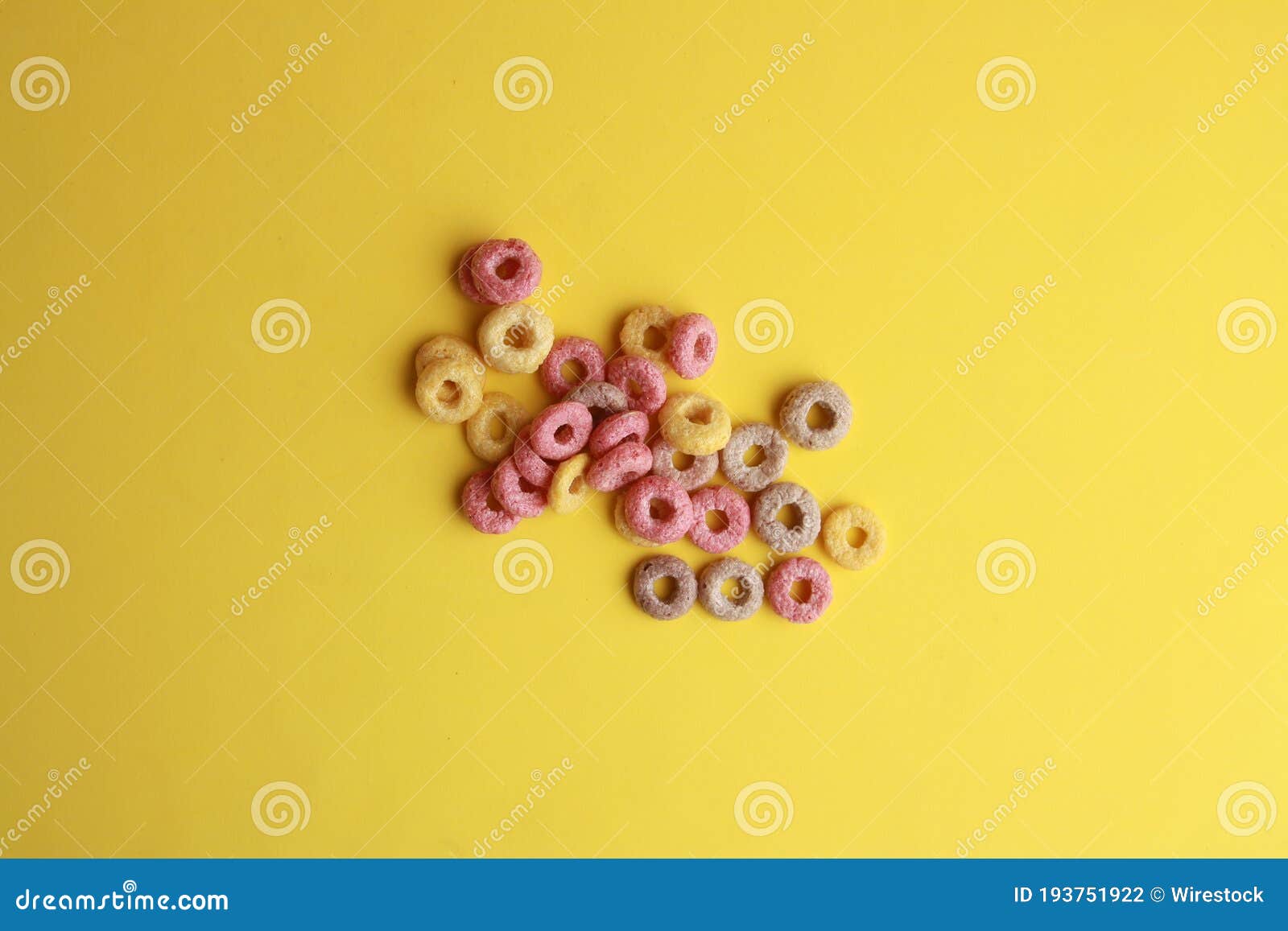 High Angle Shot of Some Colorful Fruit Loops Isolated on a Yellow ...