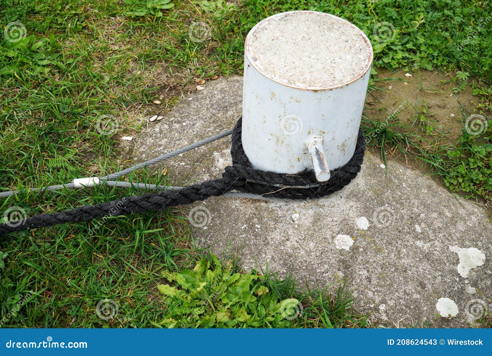 High Angle Shot of Some Ropes Wrapped Around a Pole Fixed To the Ground ...