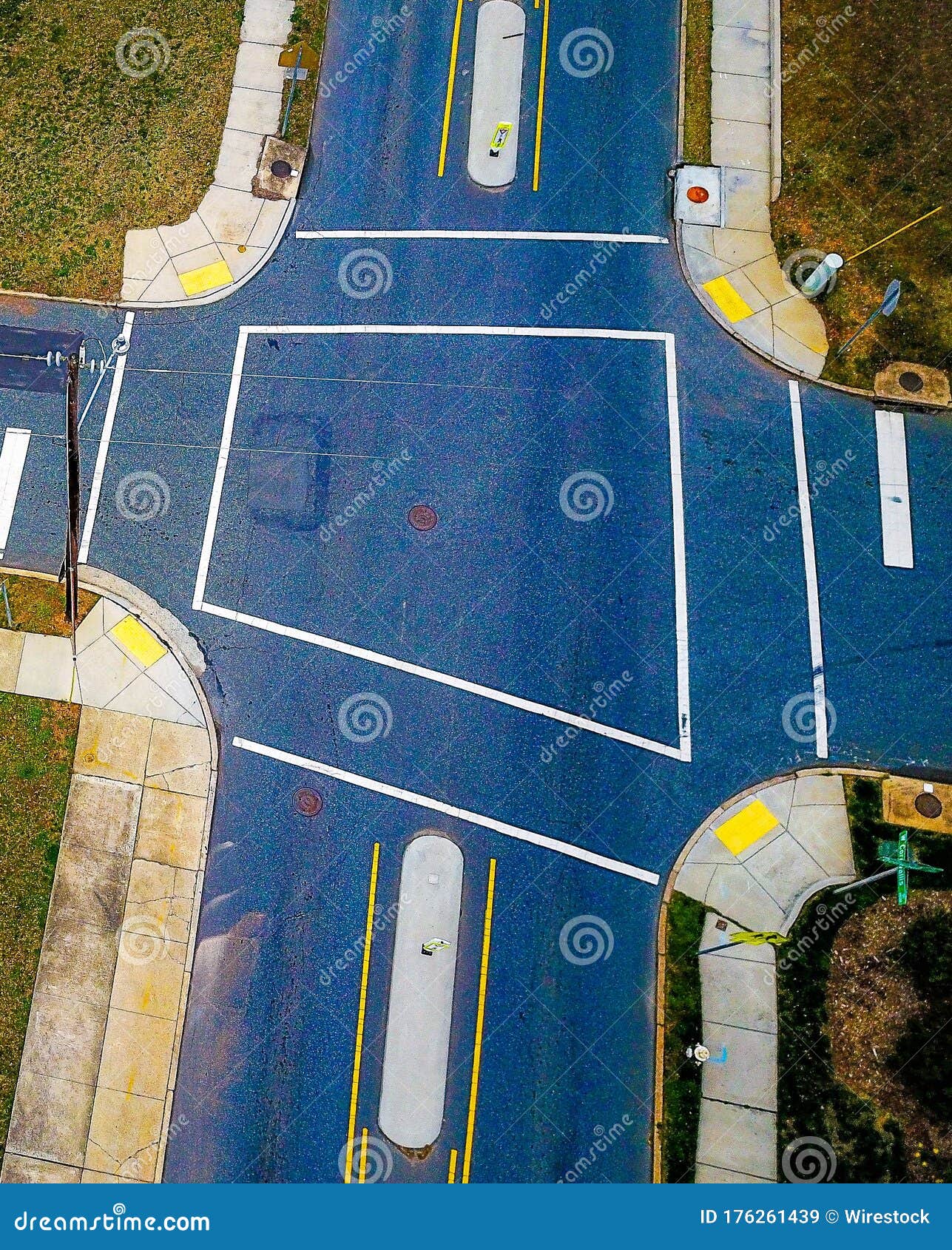 High Angle Shot of a Street Intersection with Sidewalks and Markings ...