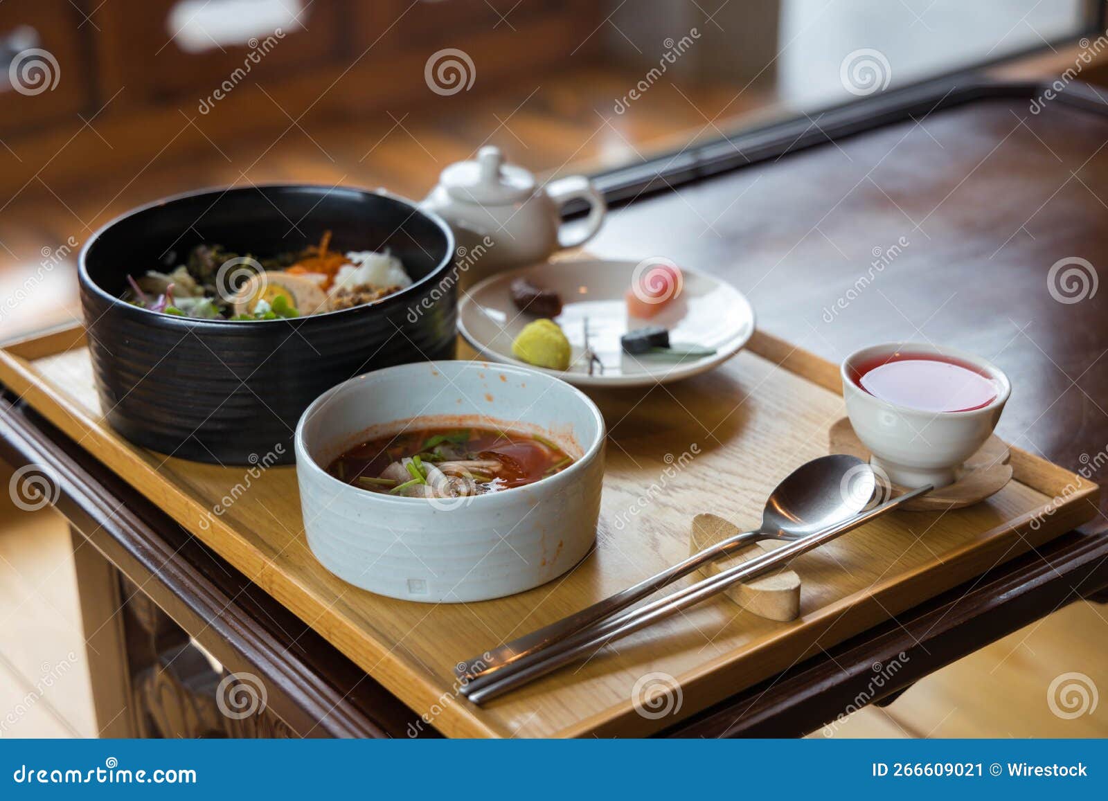 High-angle Shot of a Traditional Korean Breakfast in a Wooden Setting ...