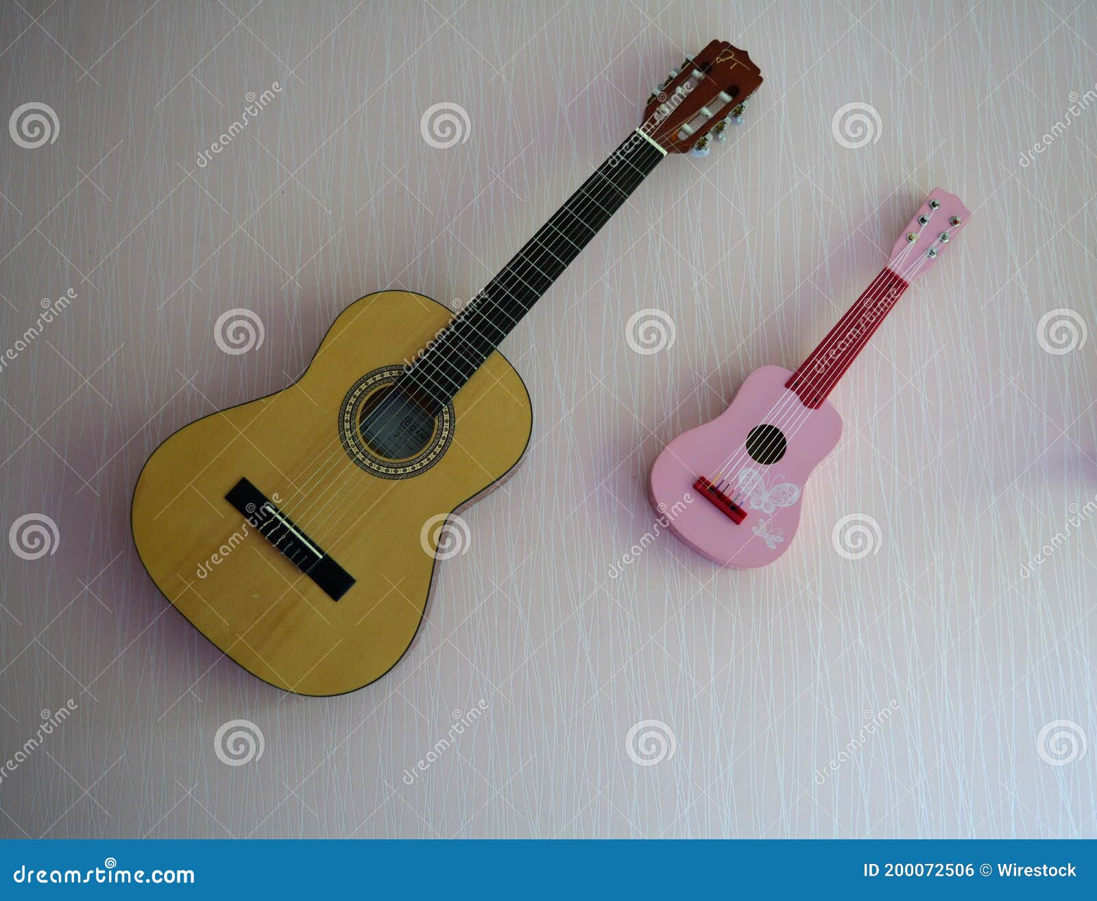 High Angle Shot of Two Guitars on a Wooden Surface Stock Photo - Image ...
