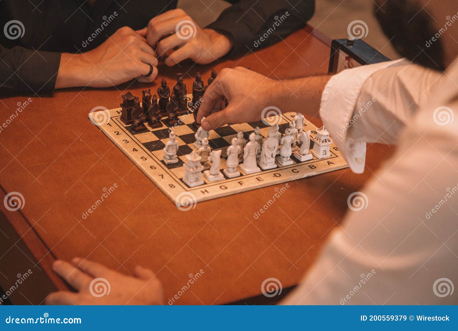 High Angle Shot of Two People Playing Chess Under the Lights Stock ...