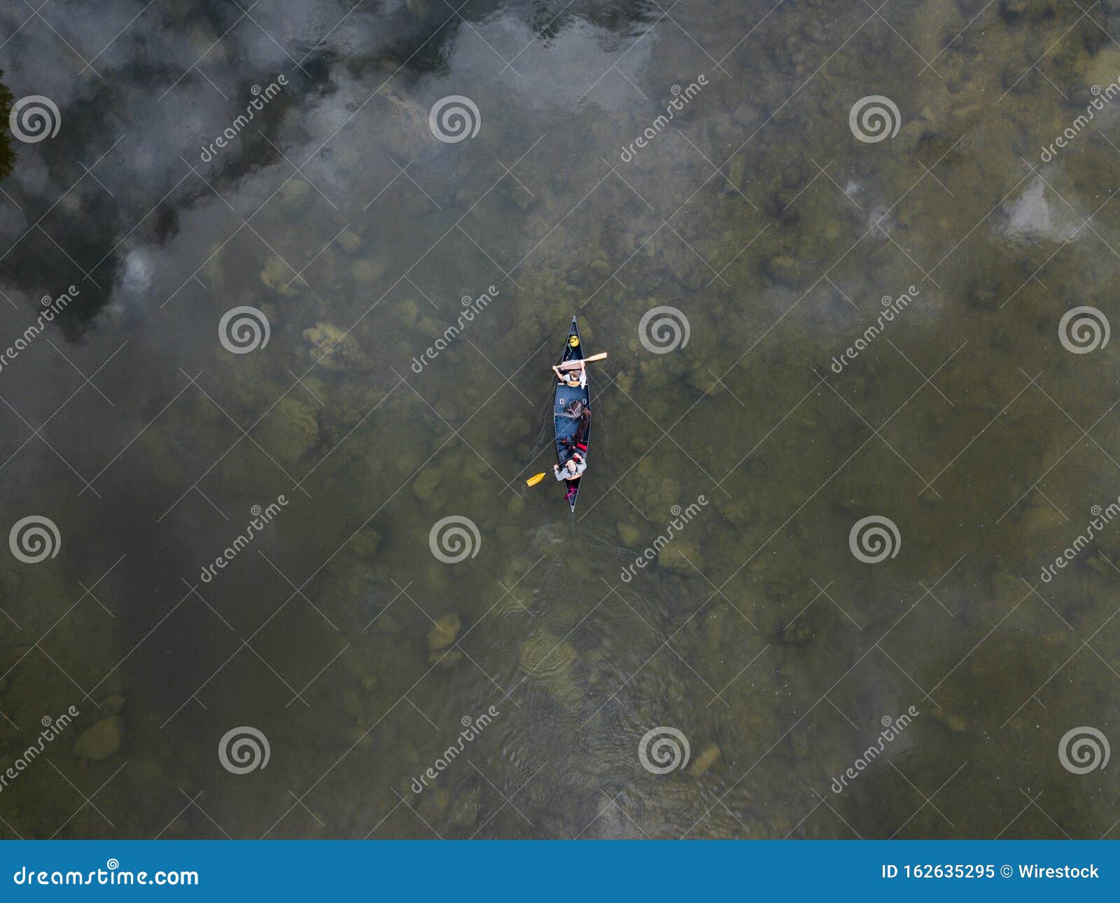 High Angle Shot of Two People on a Row Boat on a Lake Stock Image ...