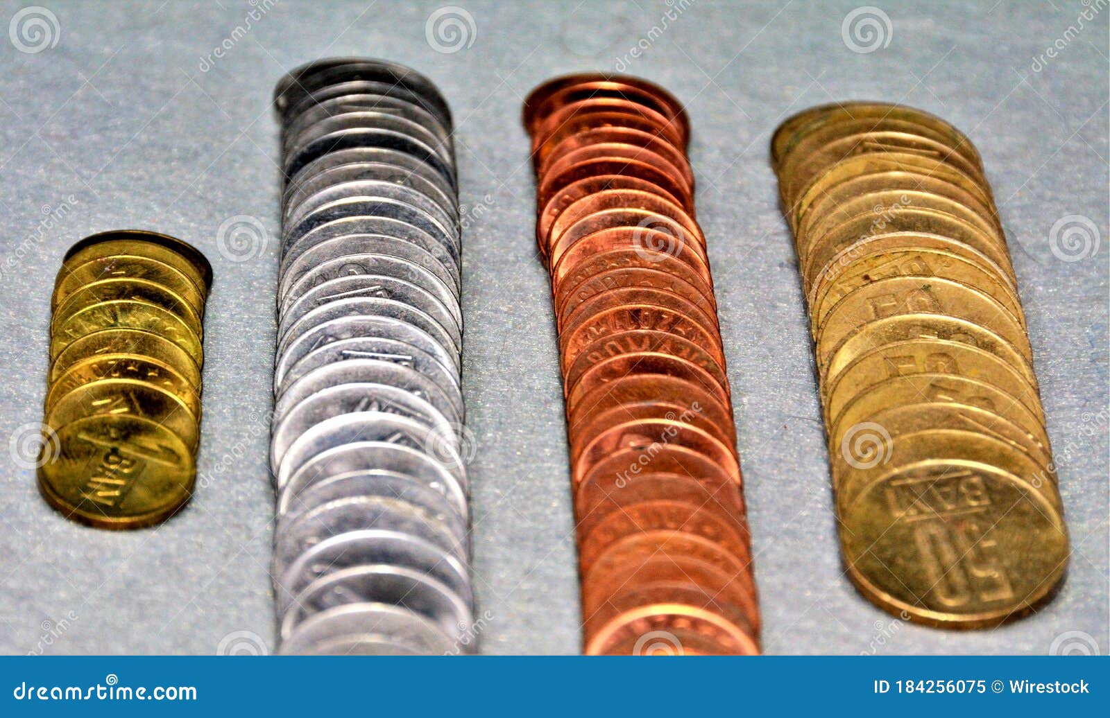 High Angle Shot of a Variety of Coins on a Grey Surface - Concept ...