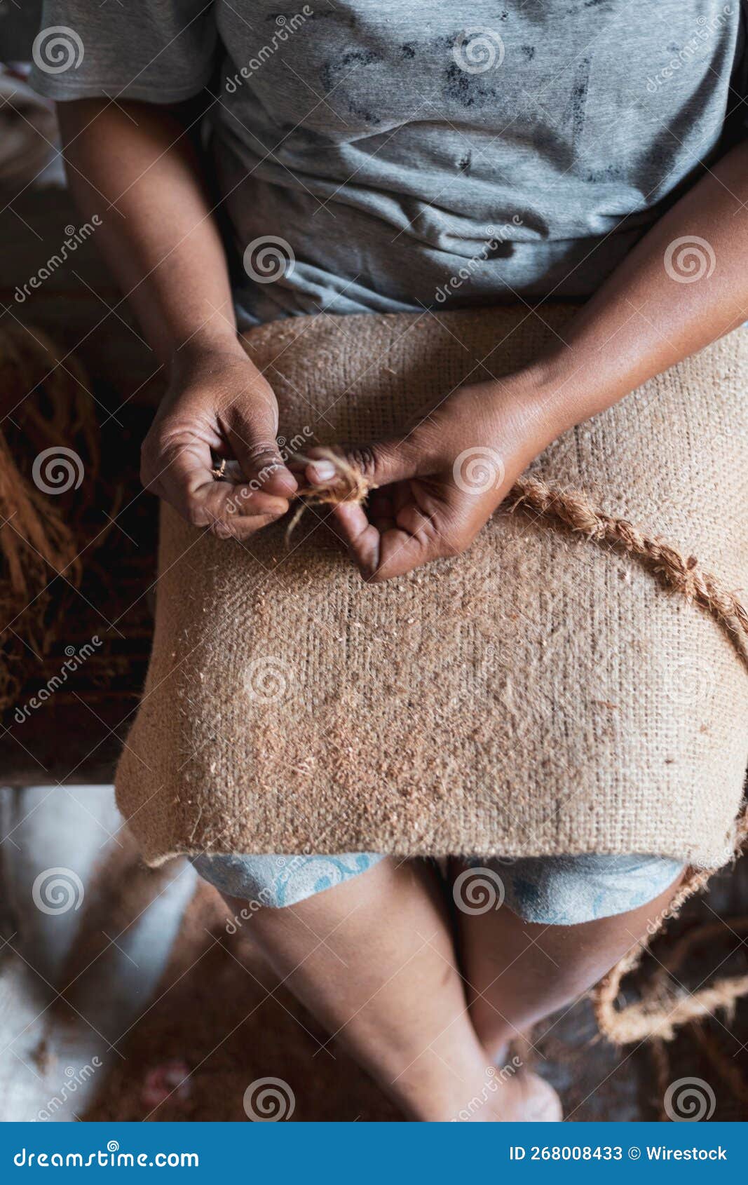 High Angle Shot of a Woman Hand Weaving a Straw String in the Daylight ...
