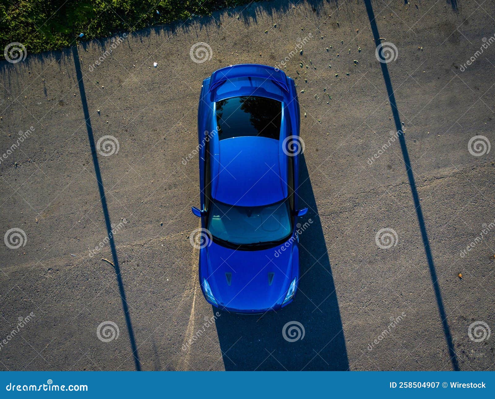 High-angle Top View of an Electric Blue Car Parked in a Location Under ...
