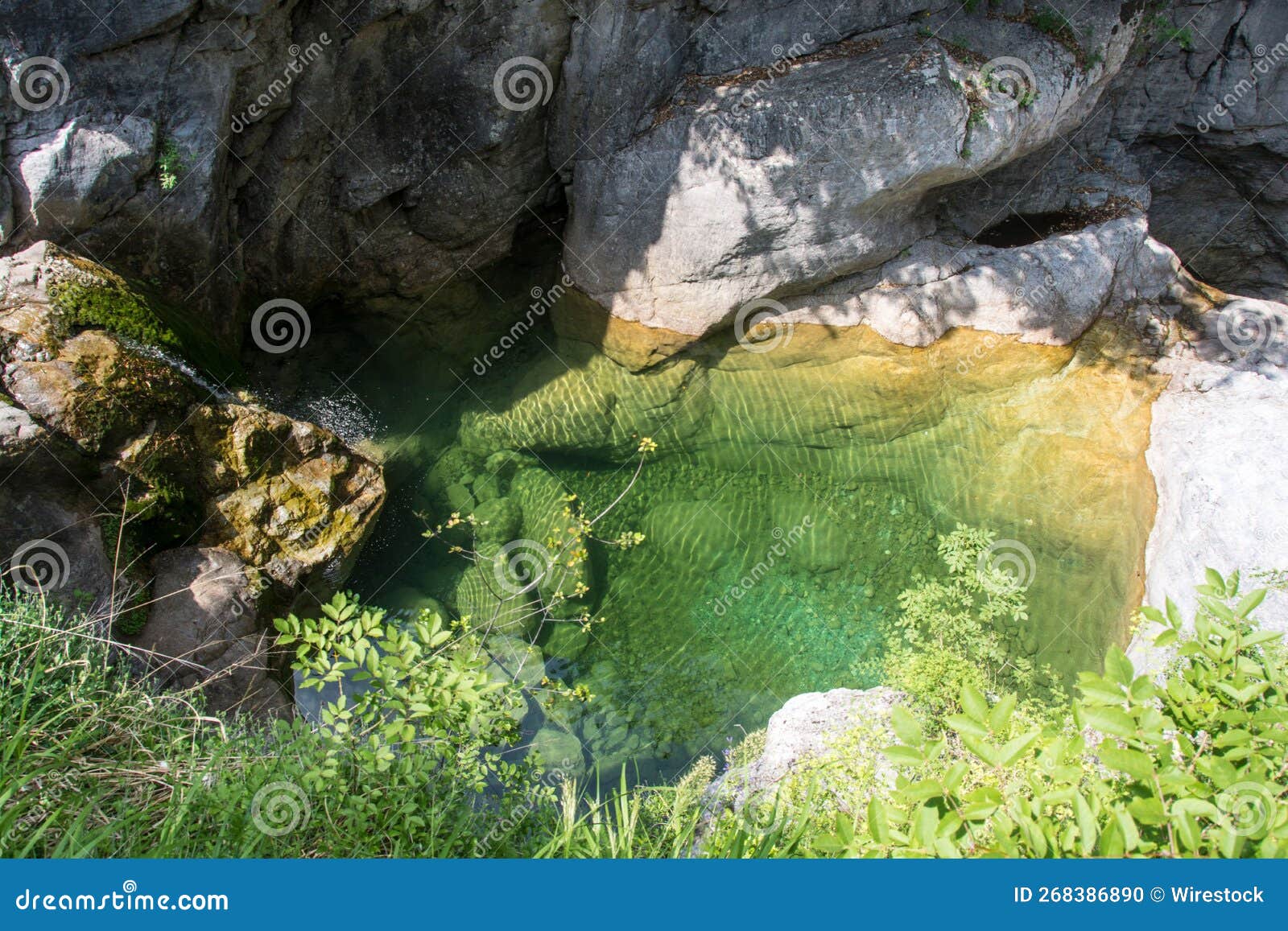 High Angle of the Turquoise Enipeus River in the Cliffs Illuminated by ...