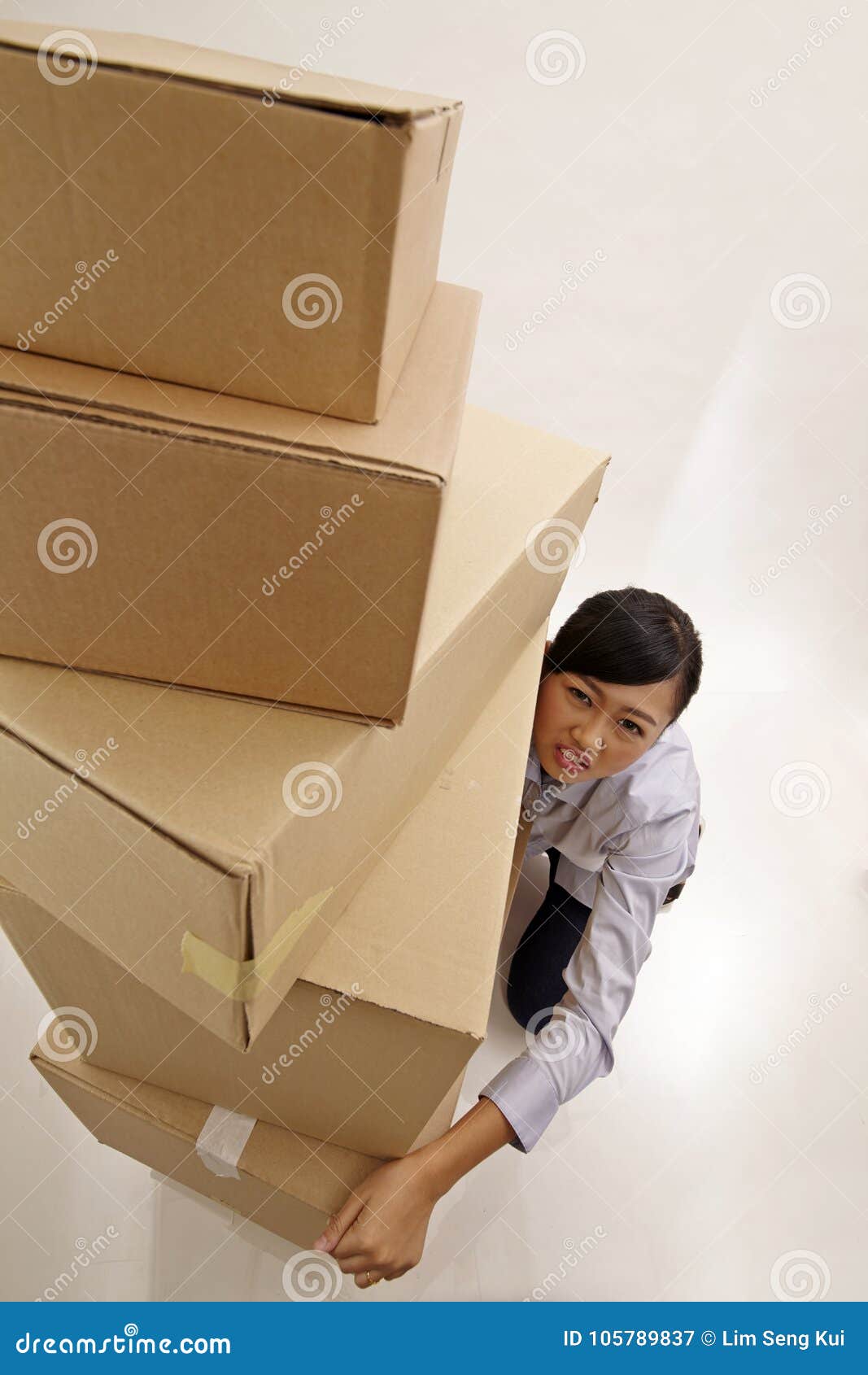 Woman lifting boxes stock image. Image of carrying, package - 105789837