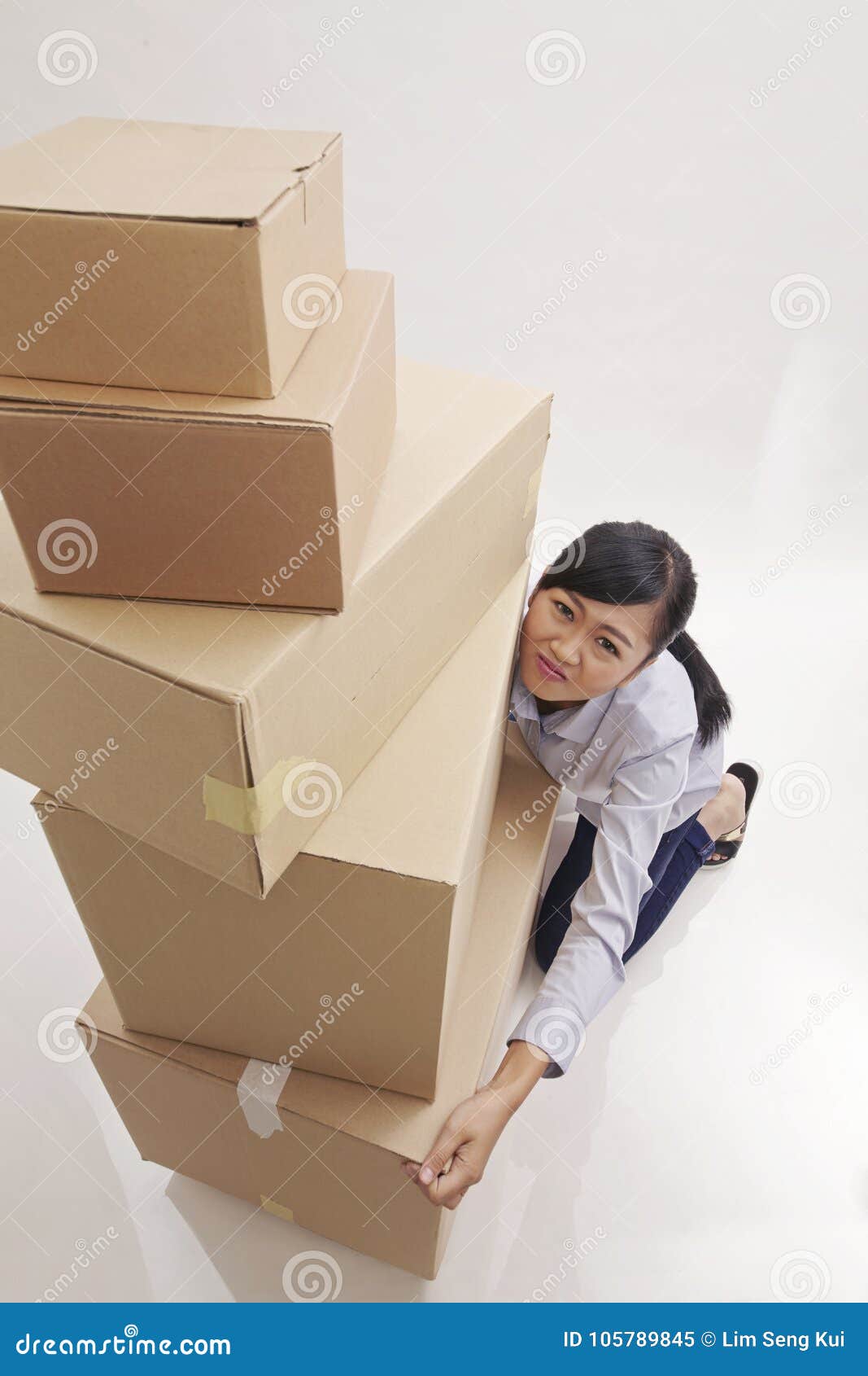 Woman lifting boxes stock image. Image of delivery, asian - 105789845