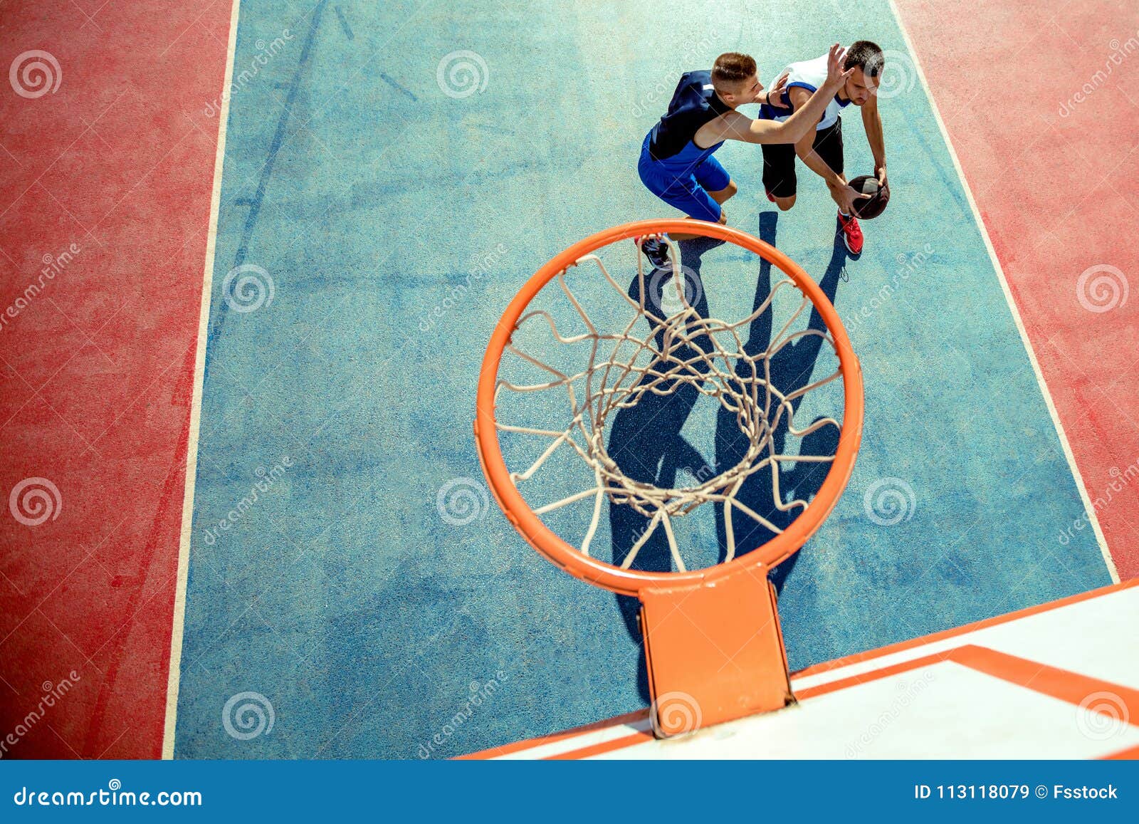 High Angle View of Basketball Player Dunking Basketball in Hoop Stock ...