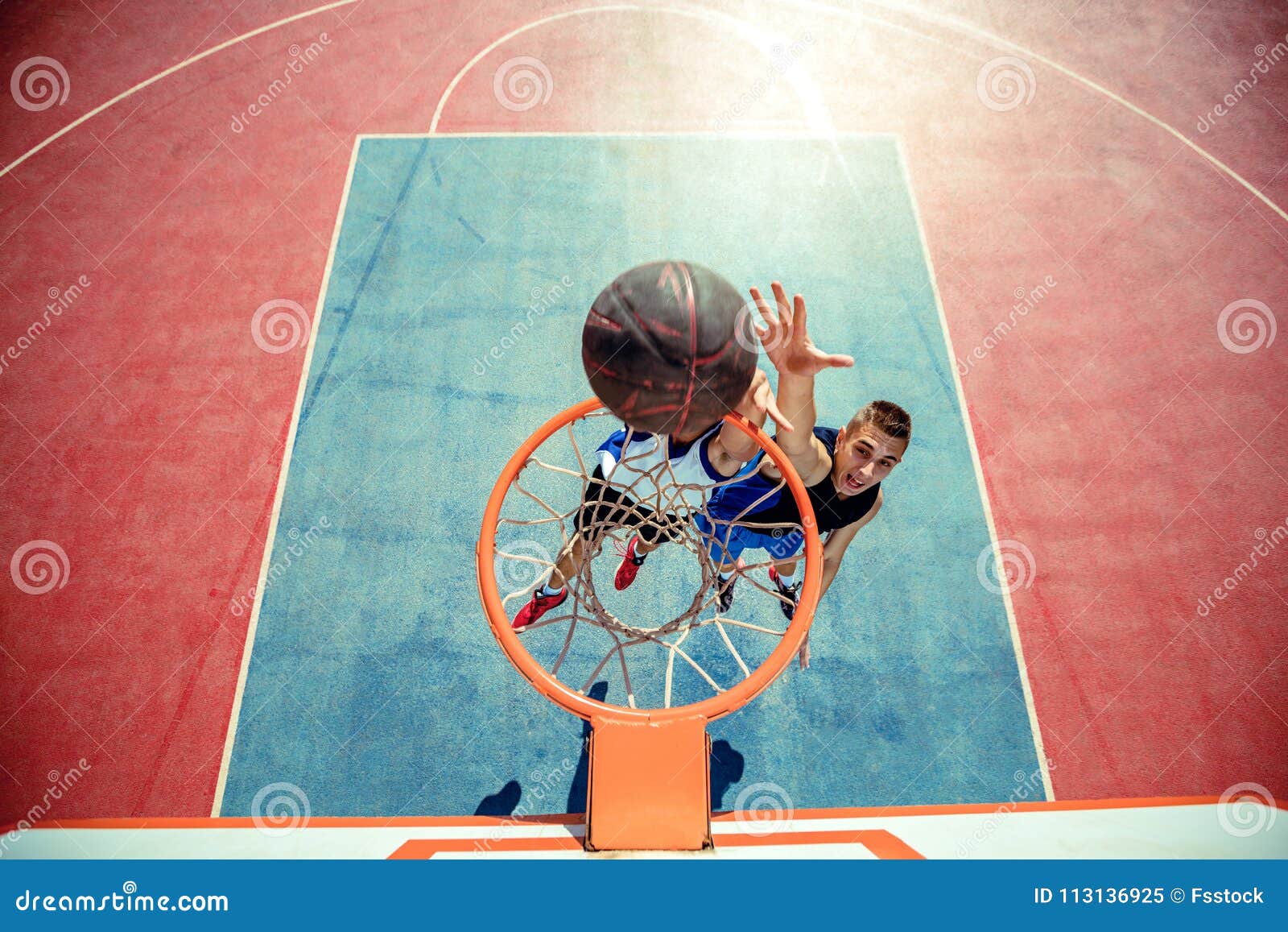 High Angle View of Basketball Player Dunking Basketball in Hoop Stock ...