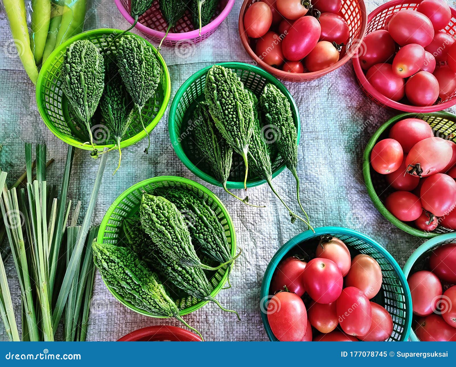 Group of Bitter Gourds and Tomatoes in Small Baskets Stock Image ...