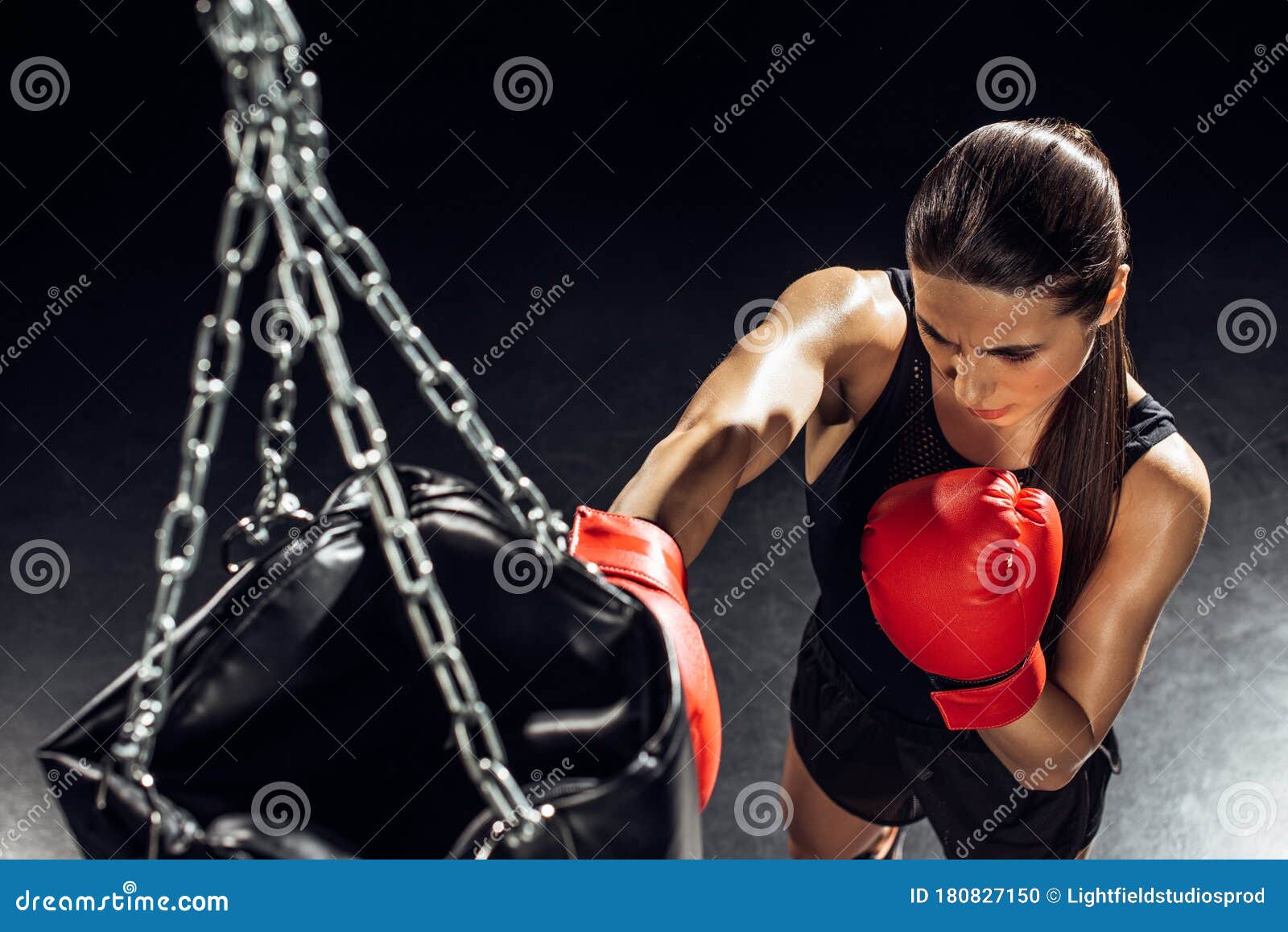 High Angle View of Boxer in Red Boxing Gloves Training with Punching ...