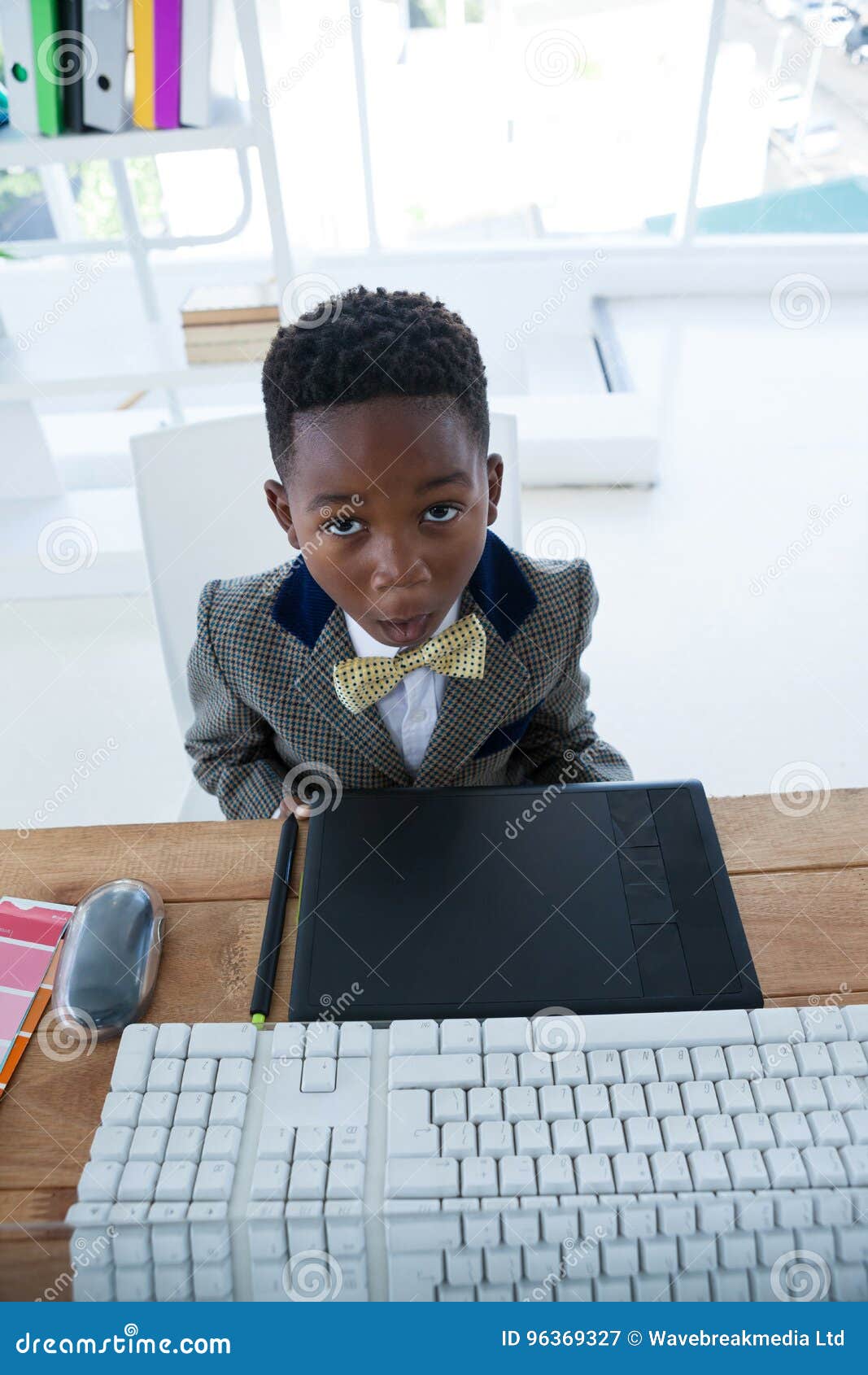 High Angle View of Boy Imitating As Businessman Sitting in Office Stock ...