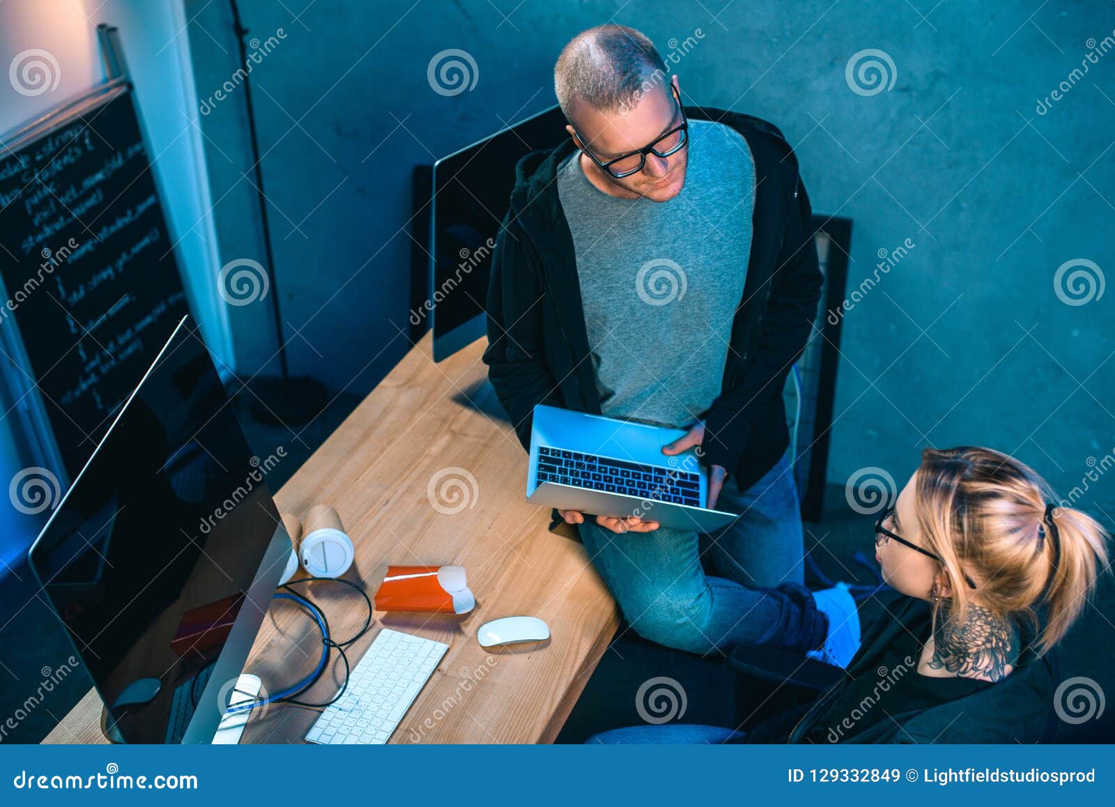 High Angle View of Couple of Hackers Working on Malware Together Stock ...